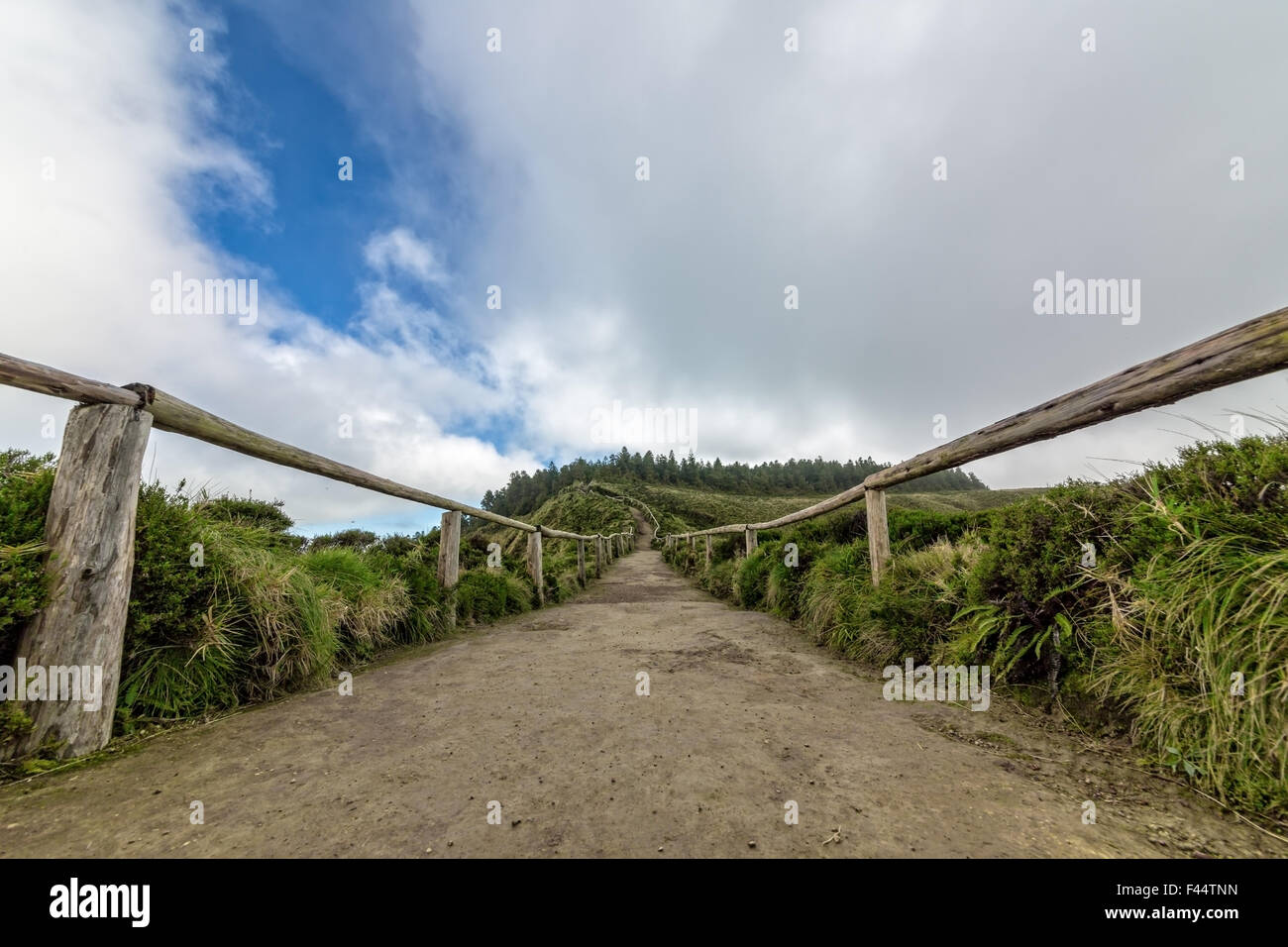 Footpath with Railing in Mountains Stock Photo - Alamy