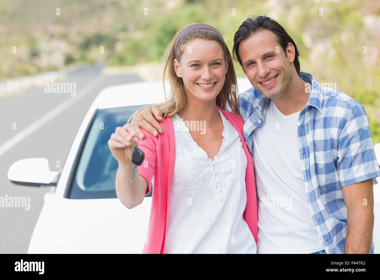 Couple showing key Stock Photo - Alamy