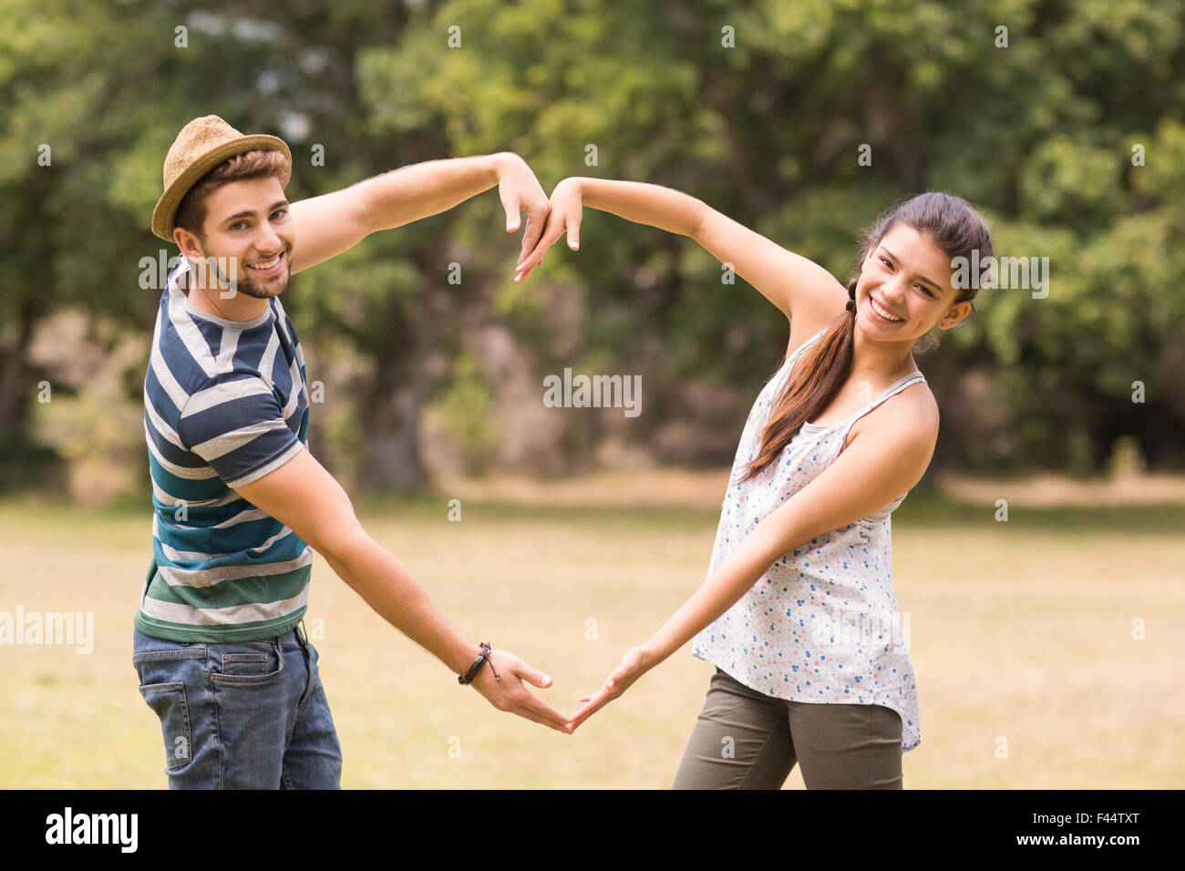 Girl making heart shape arms hi-res stock photography and images - Alamy