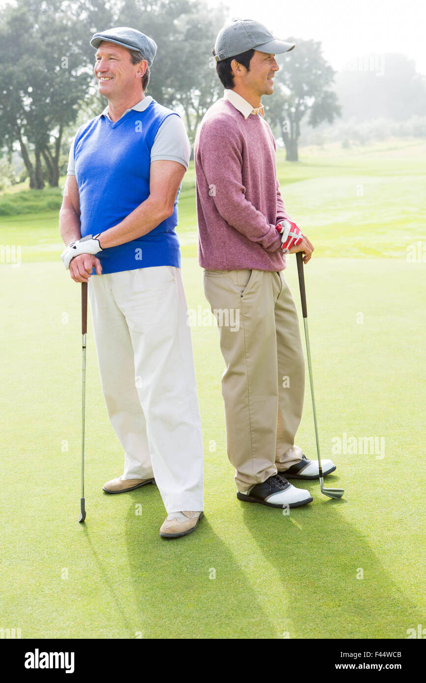 Golfer holding golf clubs hi-res stock photography and images - Alamy