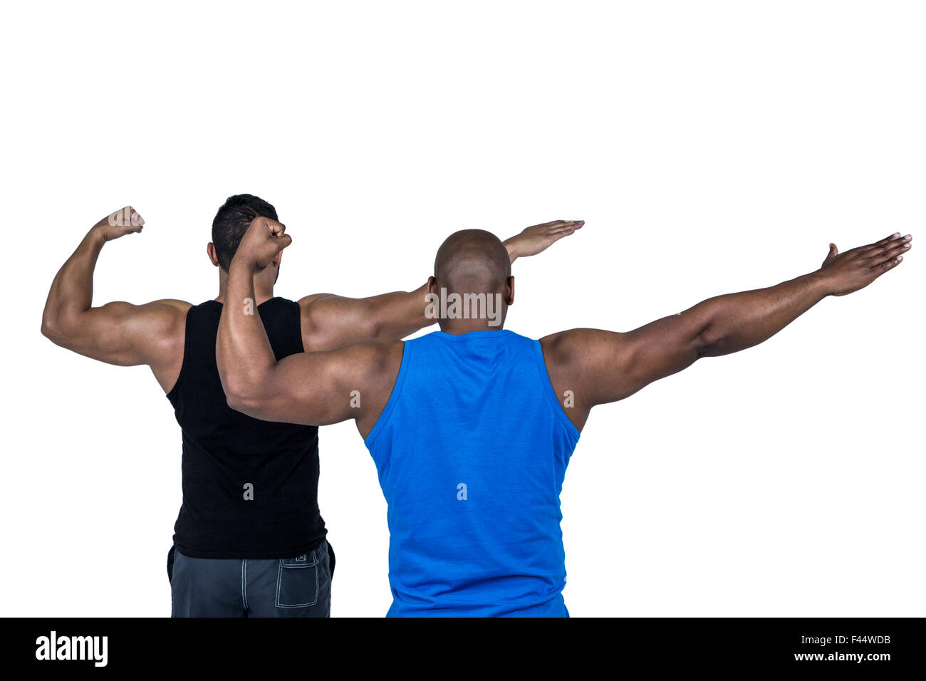 Strong friends posing with arms out Stock Photo - Alamy