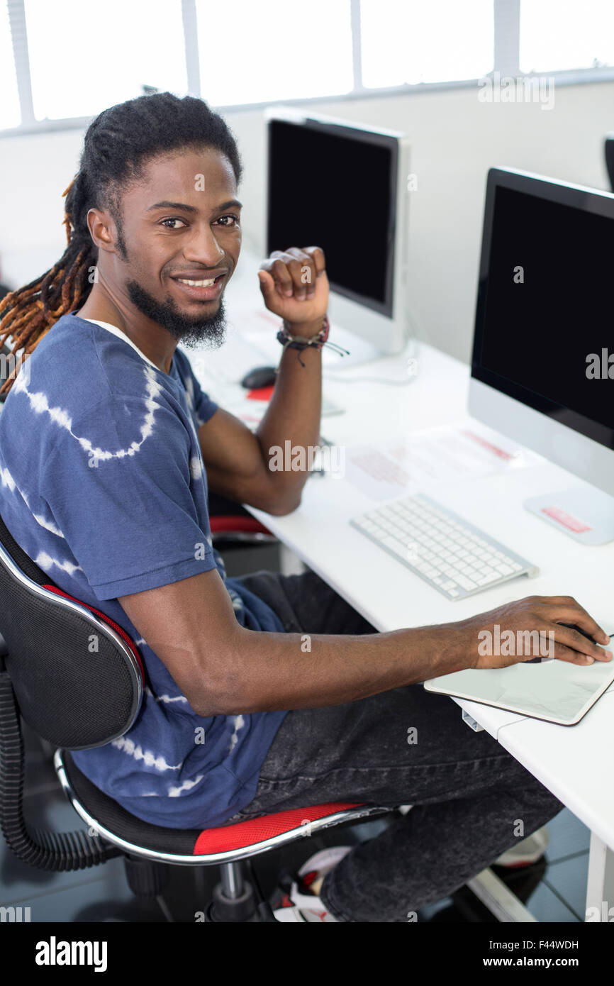 Student smiling at camera in computer class Stock Photo - Alamy