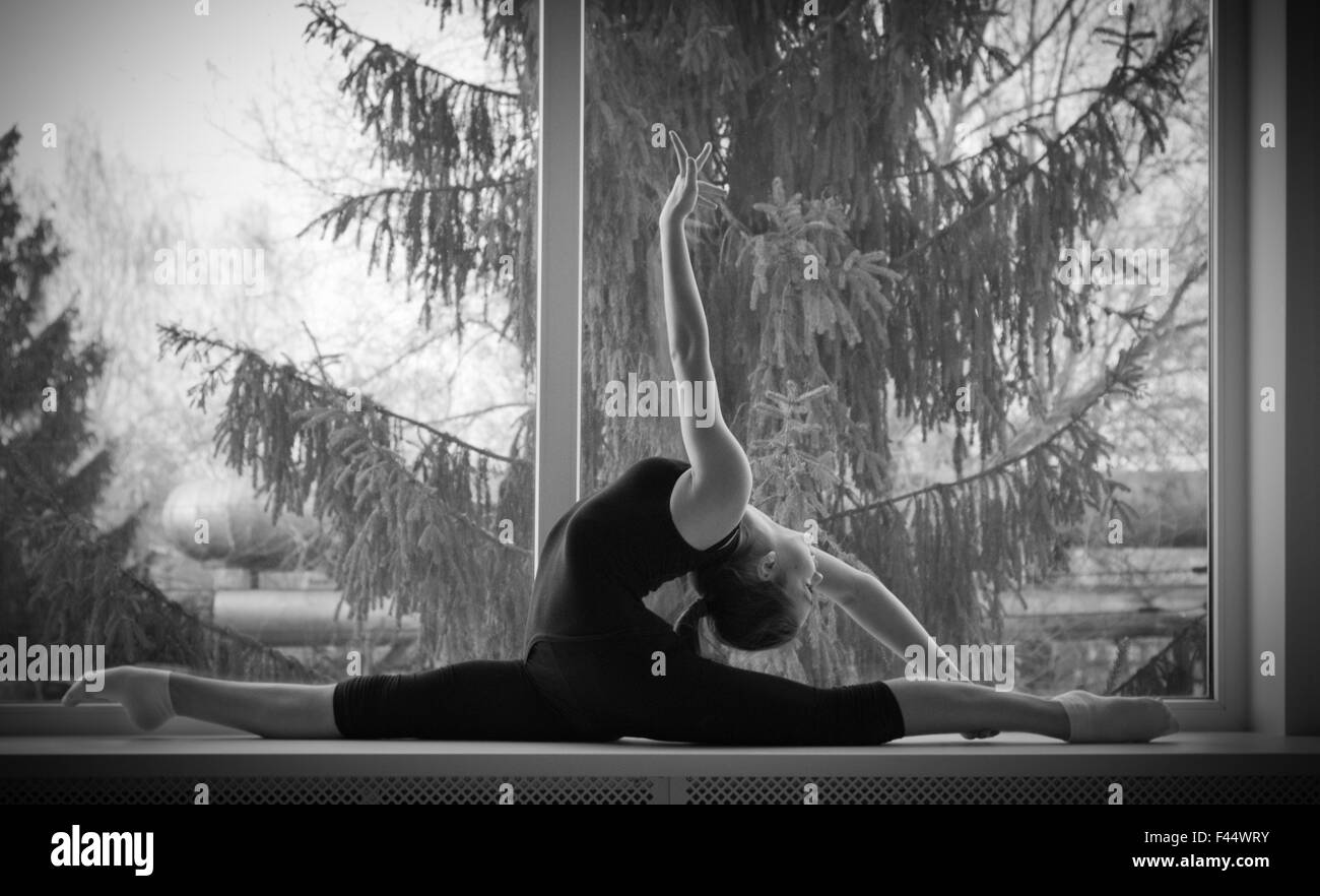 Young dancing girl on window Stock Photo - Alamy