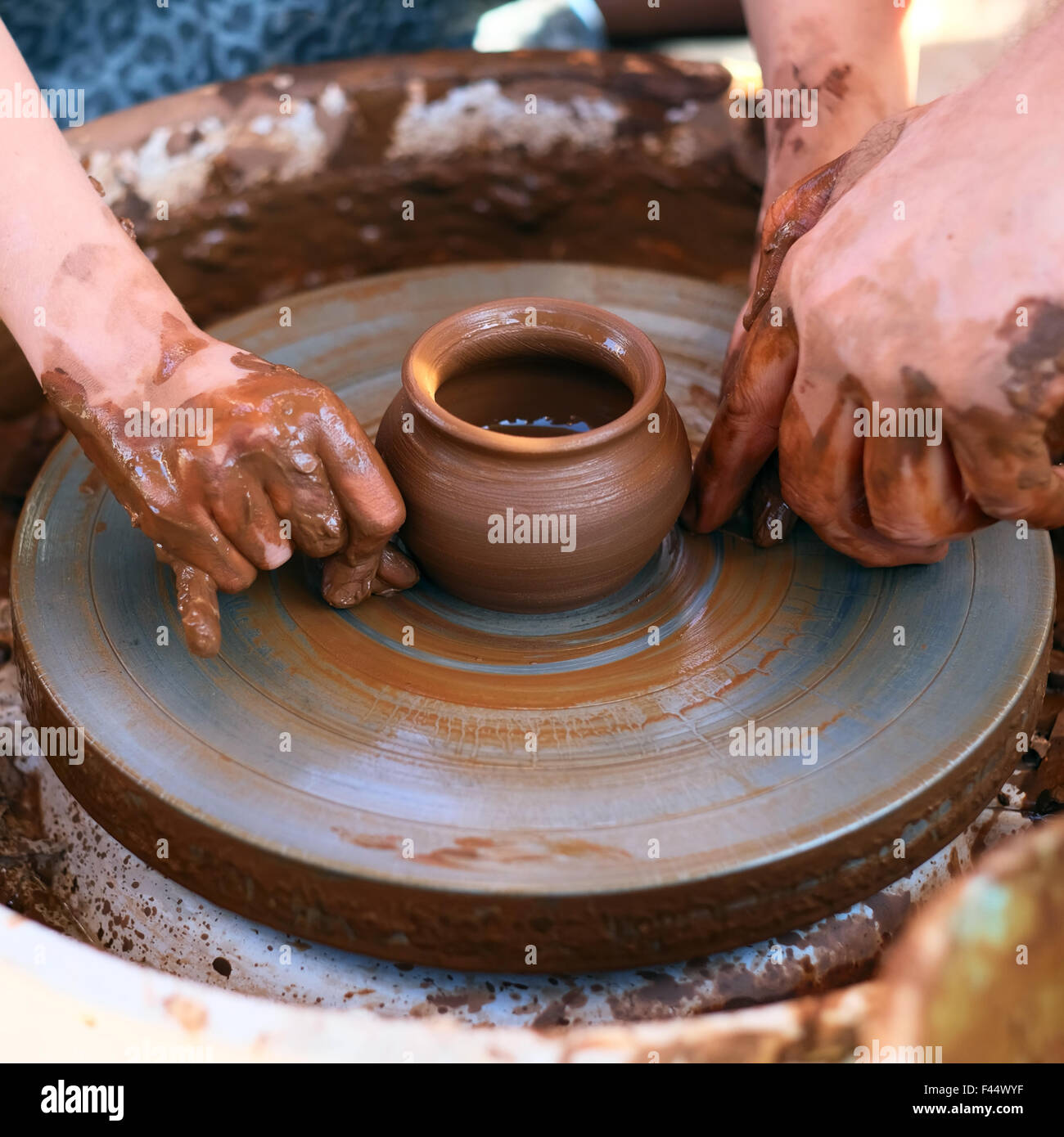 Child teacher working pottery wheel hi-res stock photography and images ...
