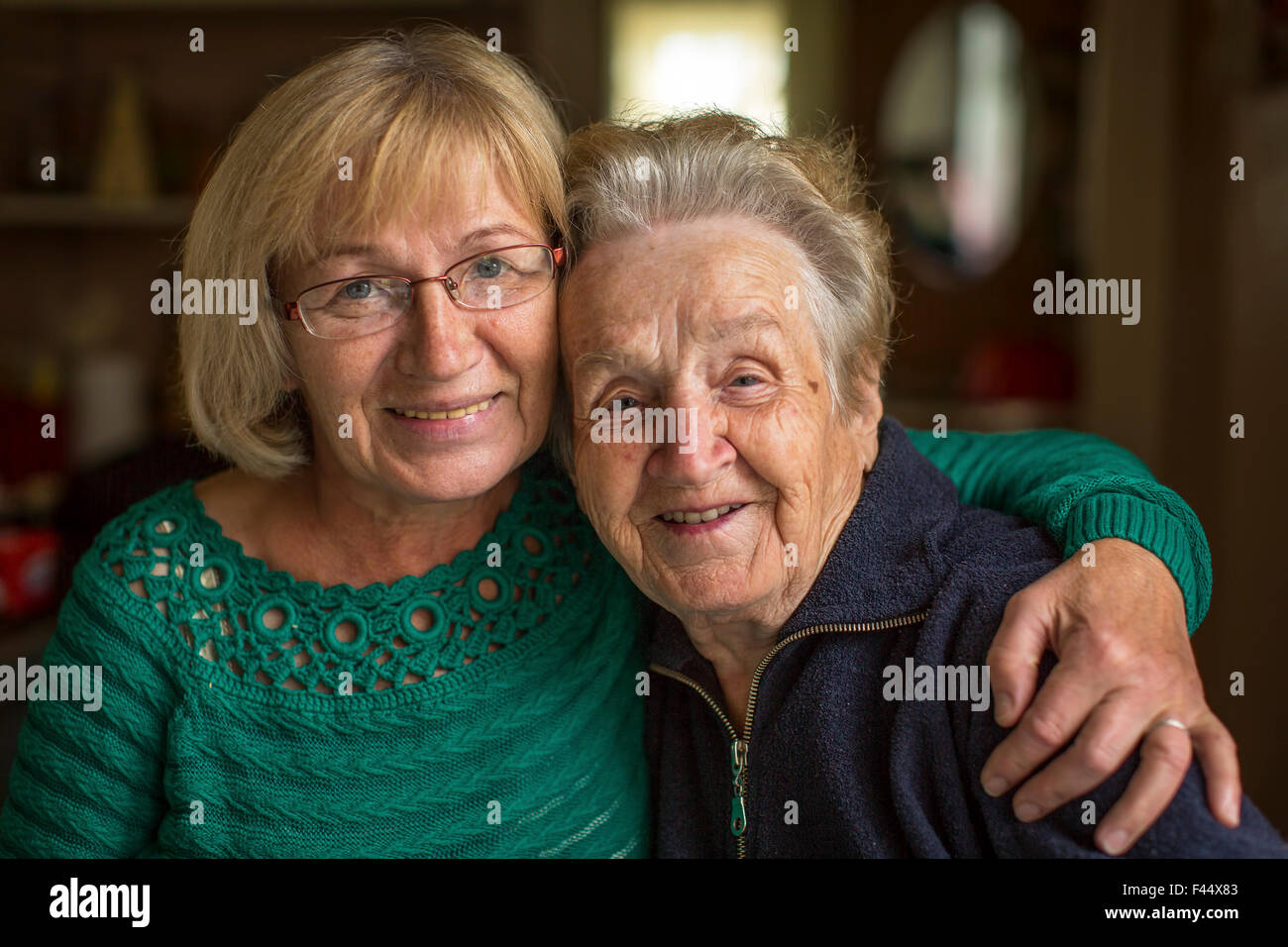 Grown woman with her old mother Stock Photo - Alamy