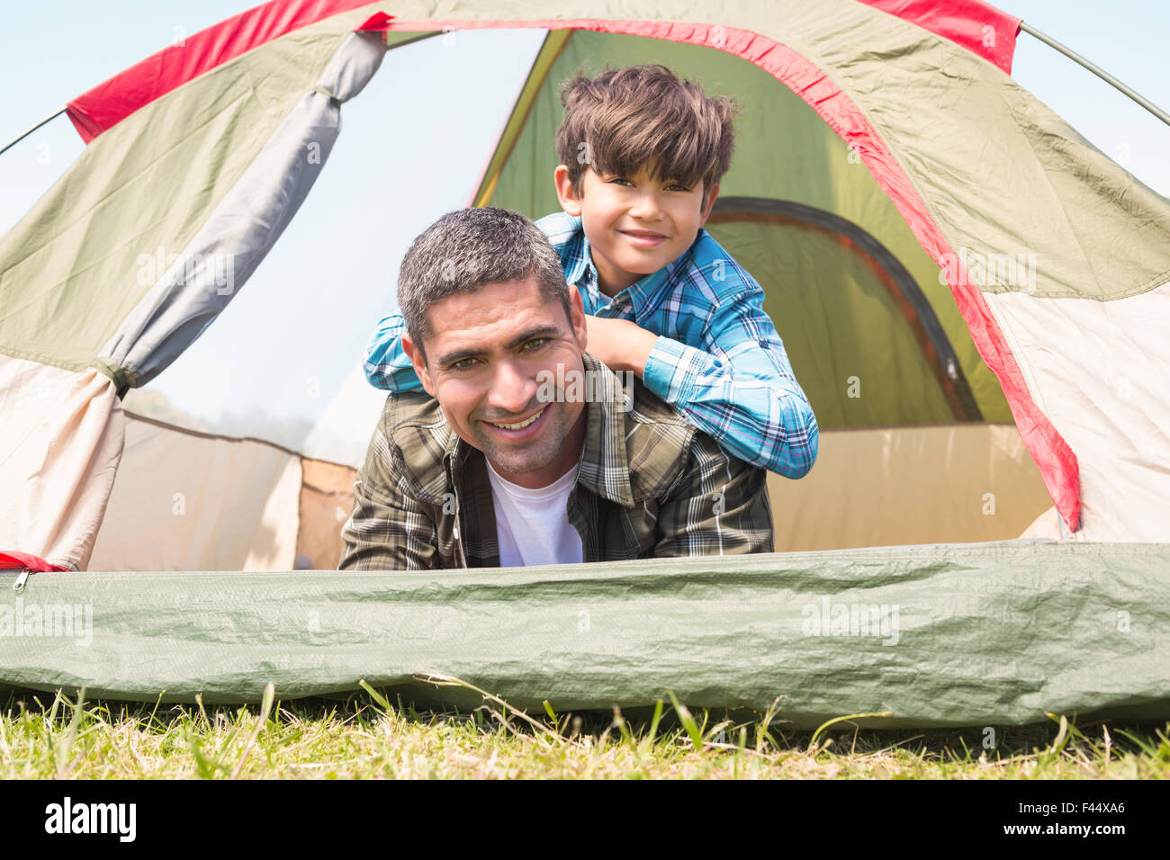 Father and son in their tent Stock Photo - Alamy