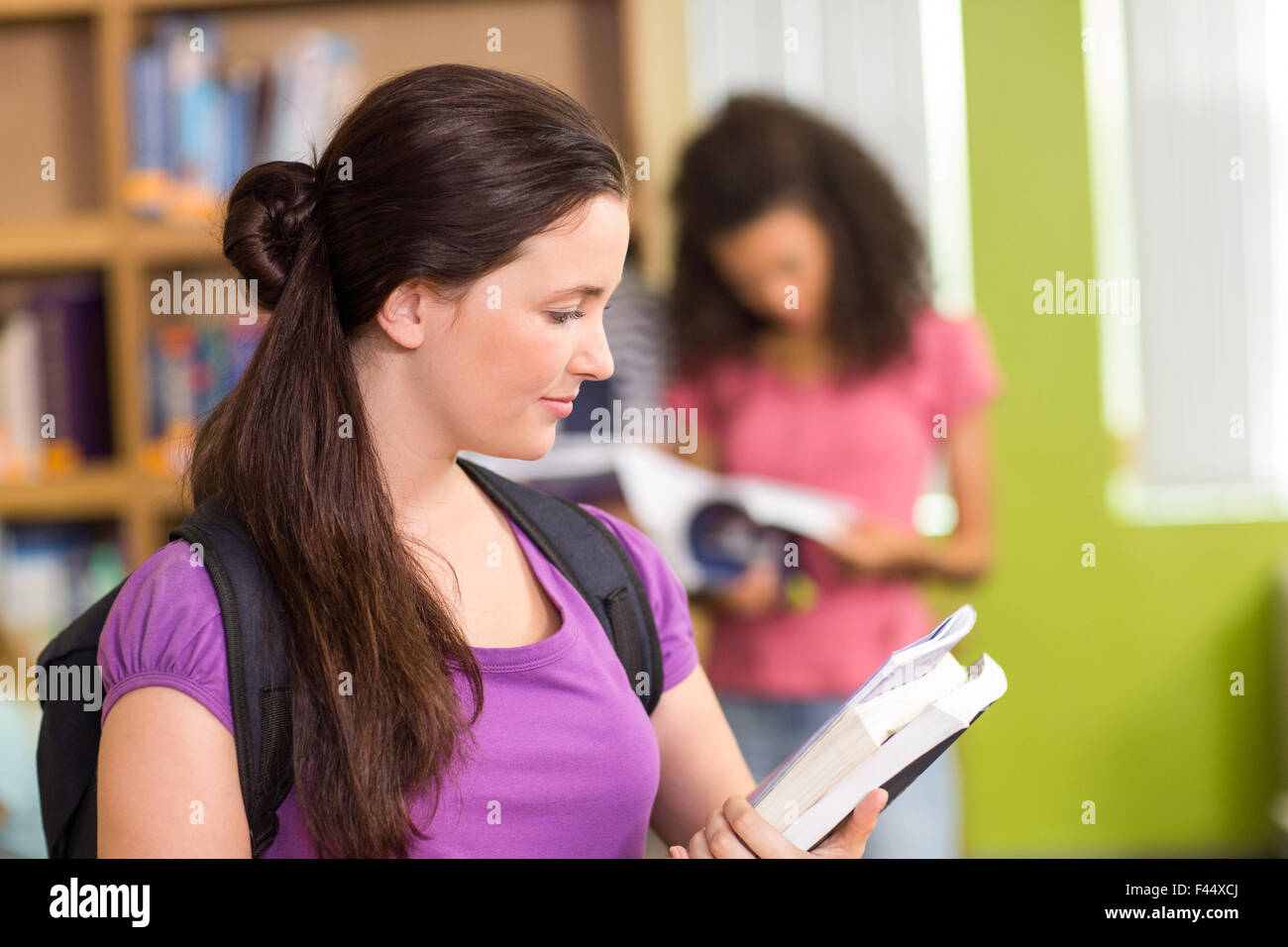 College students reading books in library Stock Photo - Alamy