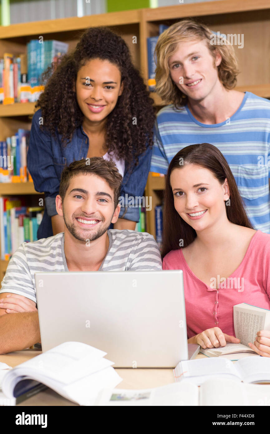 College students using laptop in library Stock Photo - Alamy