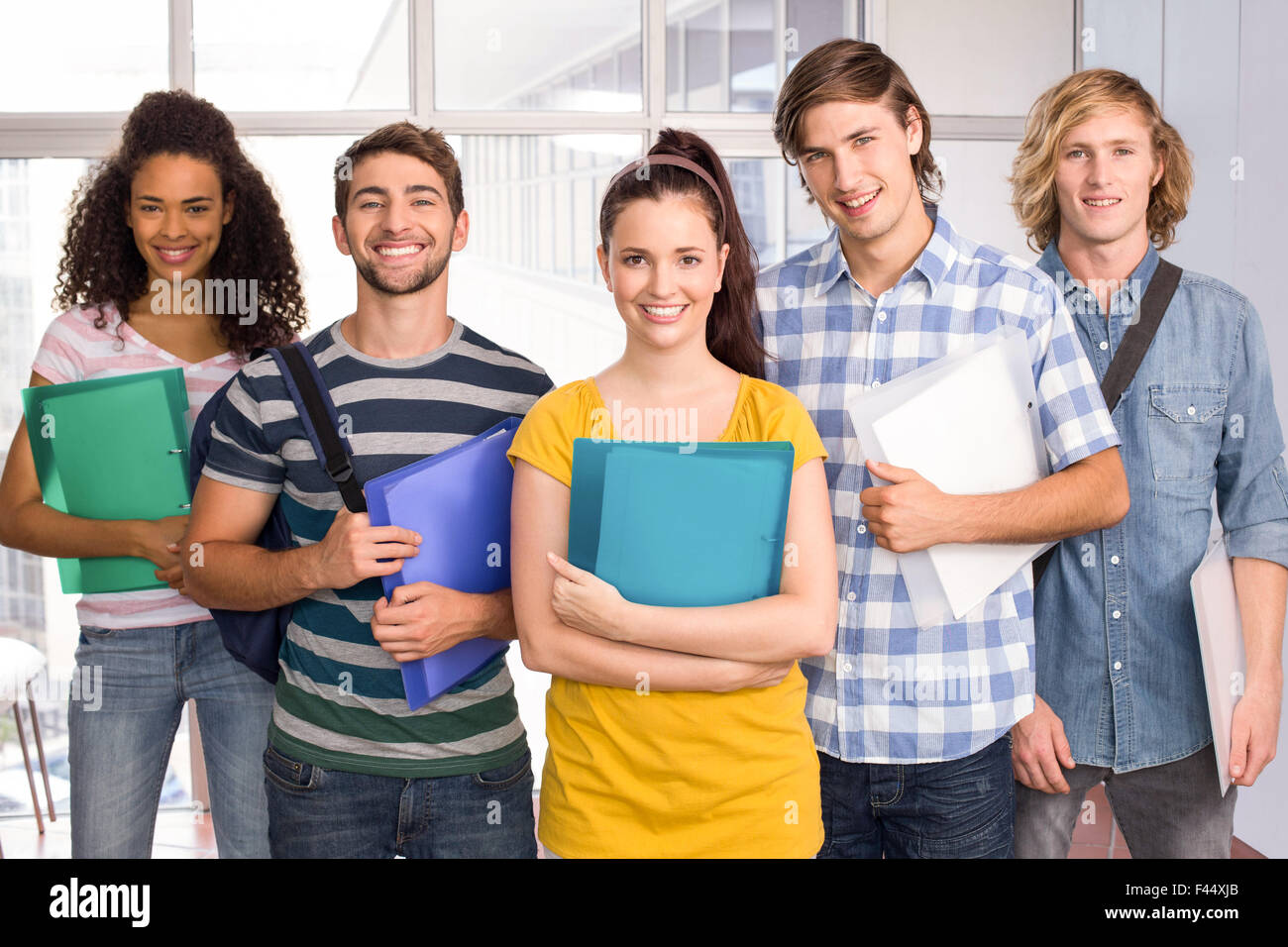 Students holding folders in college Stock Photo - Alamy