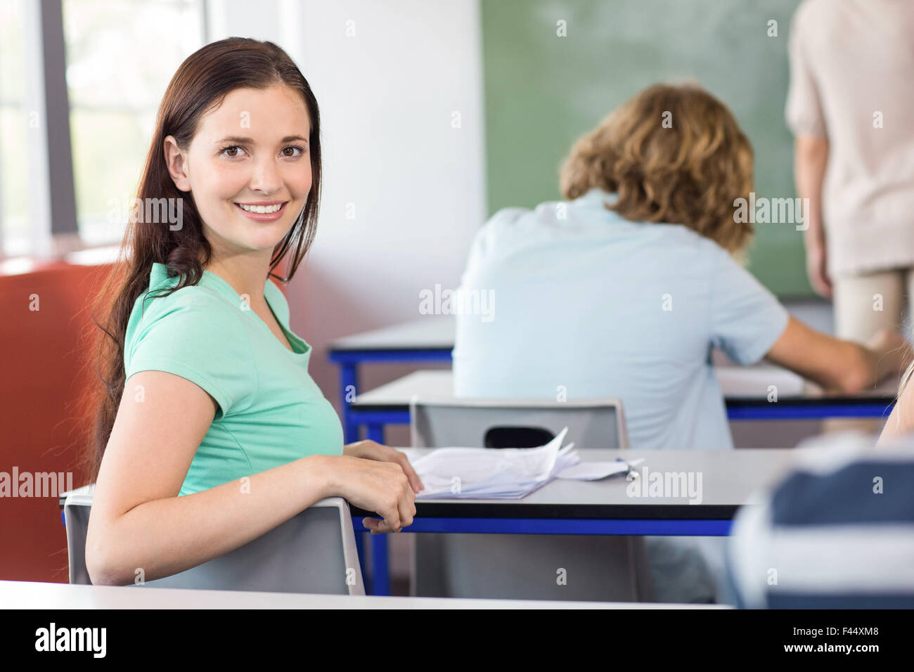 Beautiful female student in class Stock Photo - Alamy