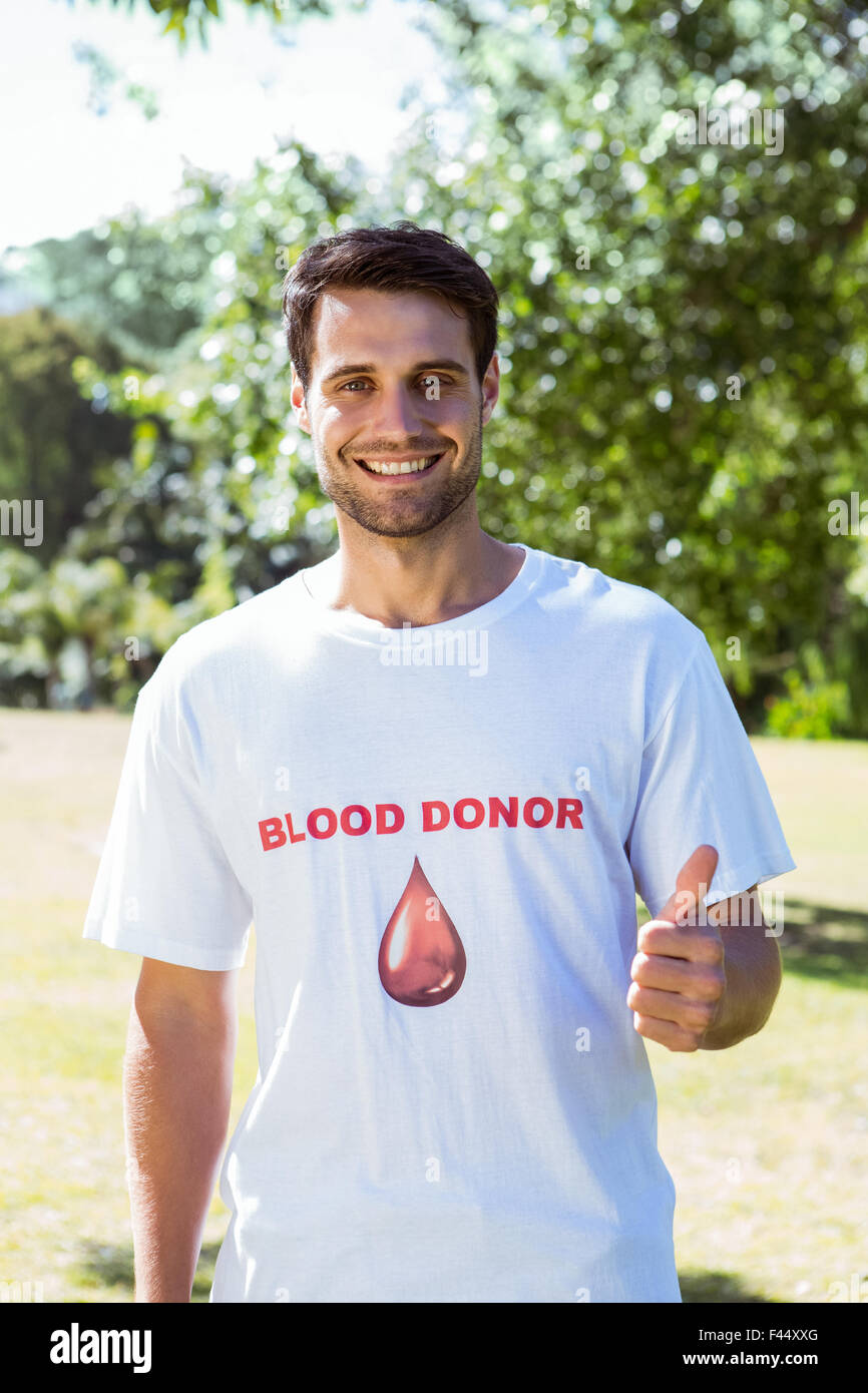Blood donor showing thumbs up Stock Photo - Alamy