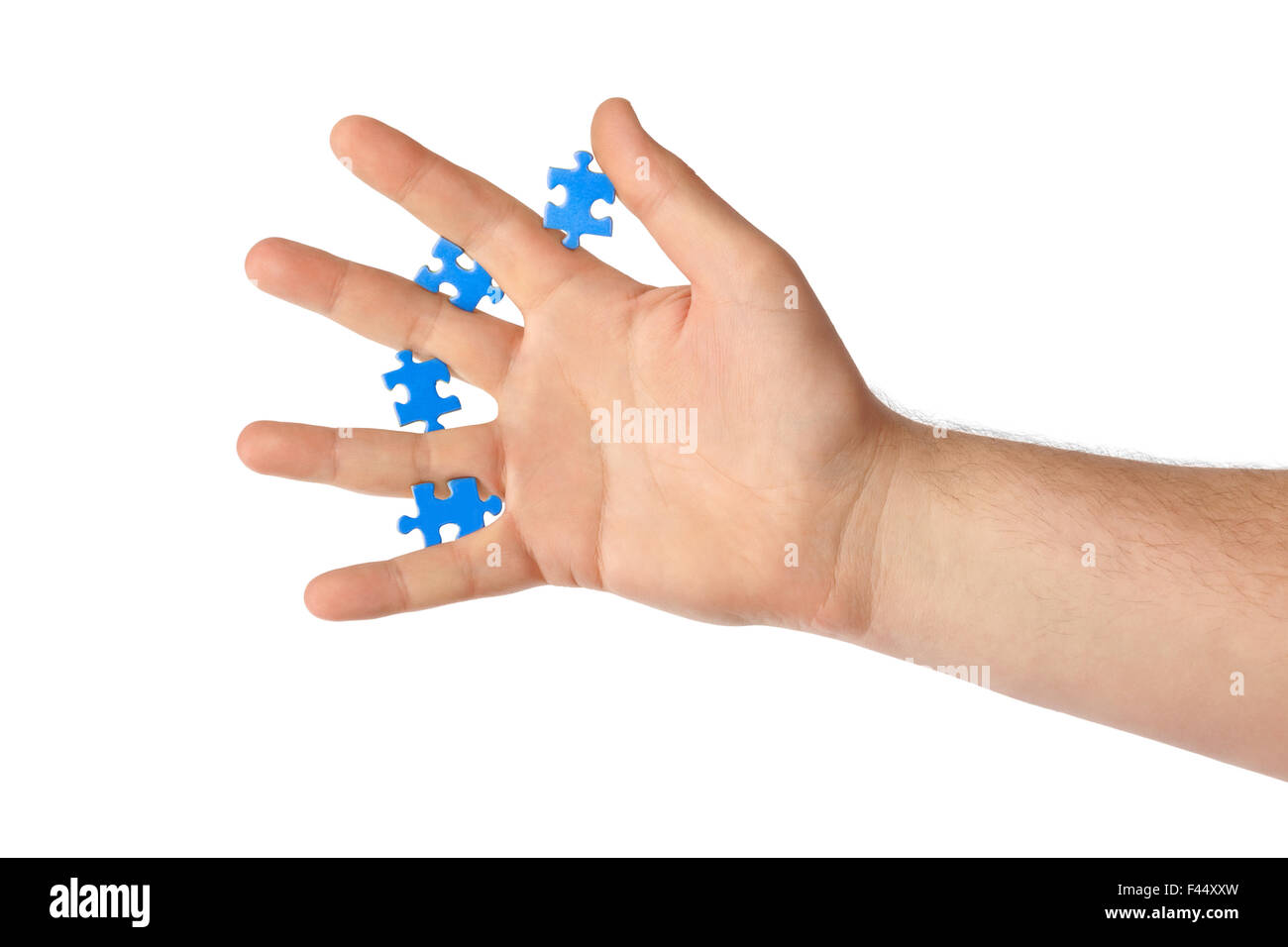 Hand and puzzle Stock Photo - Alamy