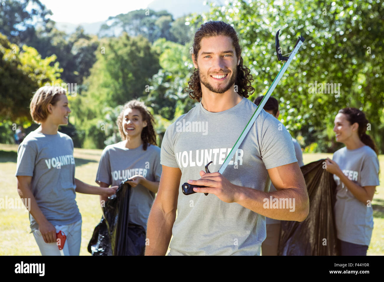 Team of volunteers picking up trash Stock Photo - Alamy