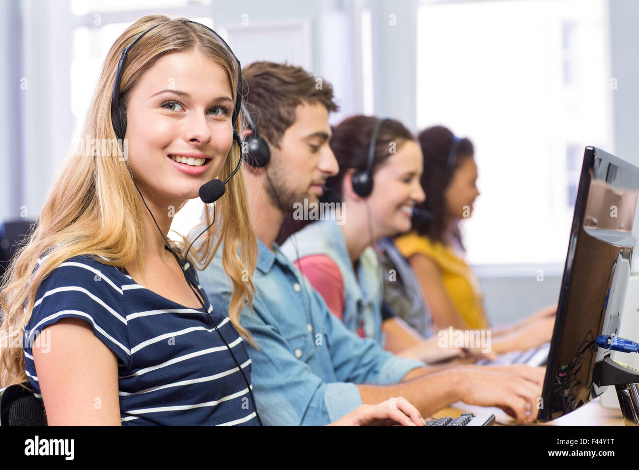 Students using headsets in computer class Stock Photo - Alamy