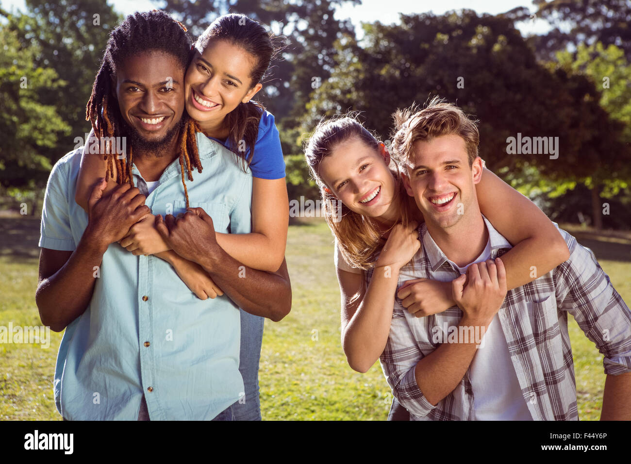 Happy friends in the park Stock Photo - Alamy
