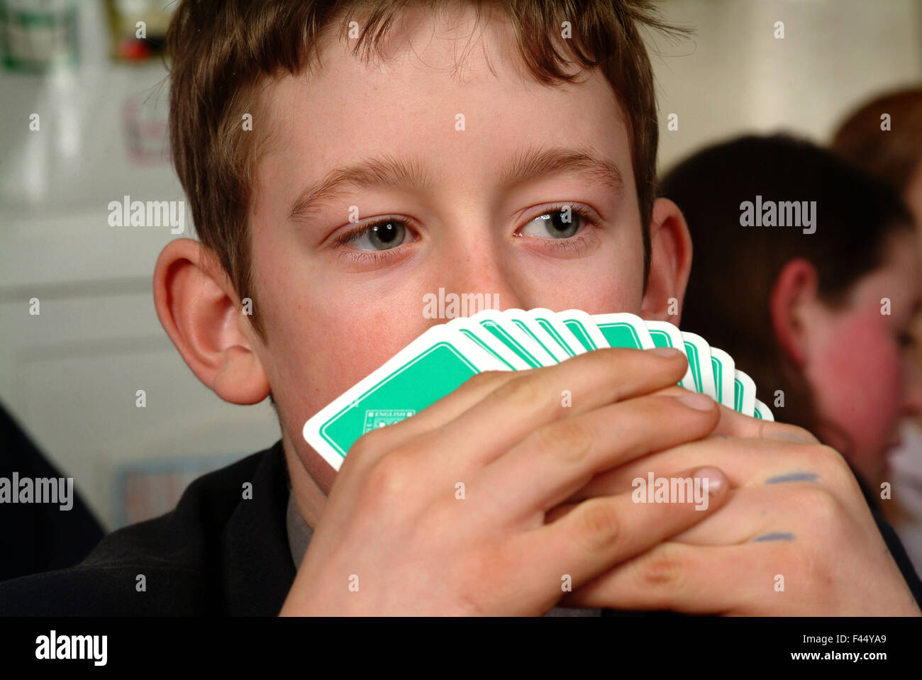 Children playing cards uk hi-res stock photography and images - Alamy