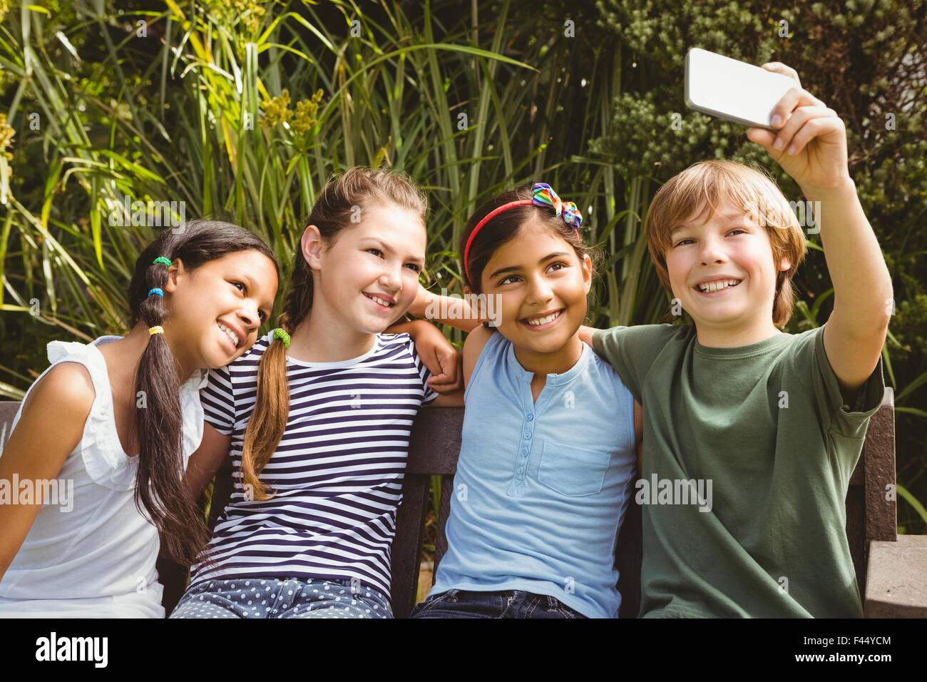 Happy children taking selfie at park Stock Photo - Alamy