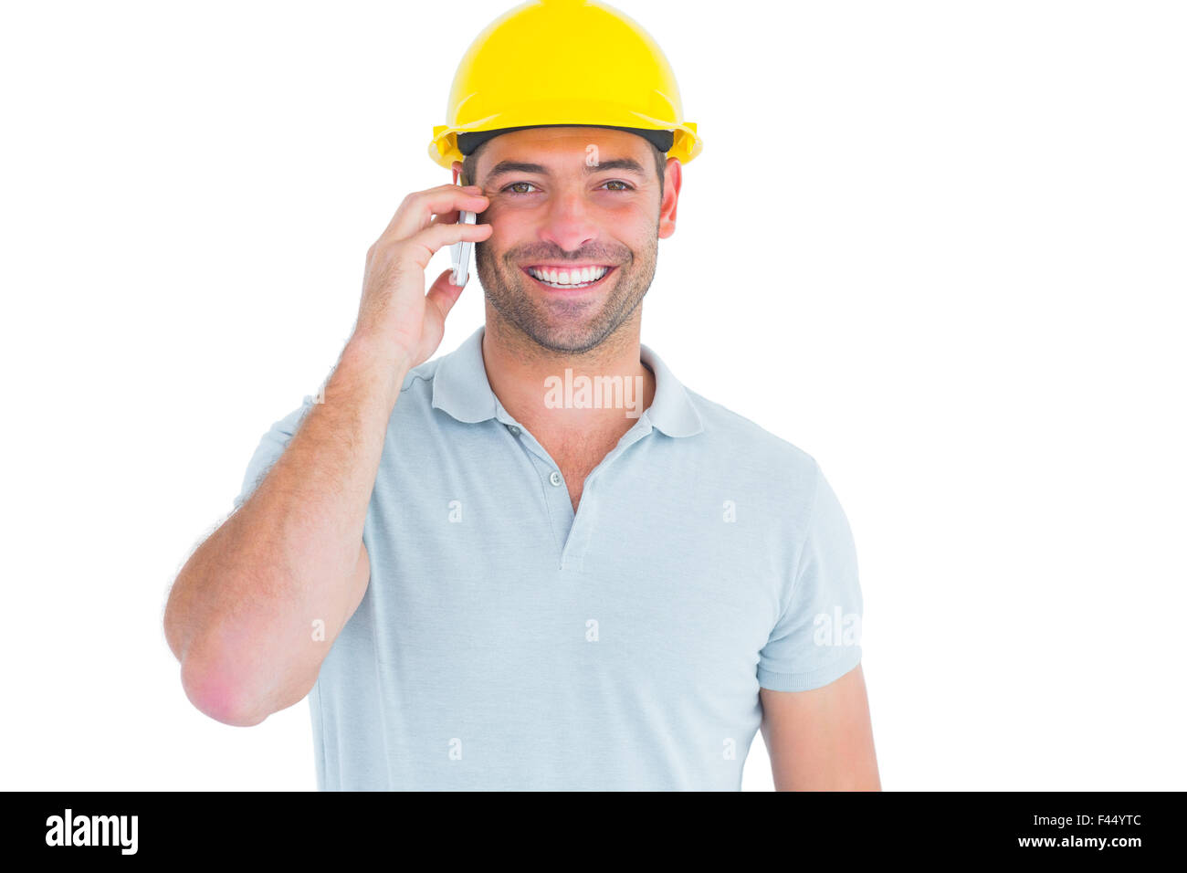 Smiling handyman talking on mobile phone Stock Photo - Alamy