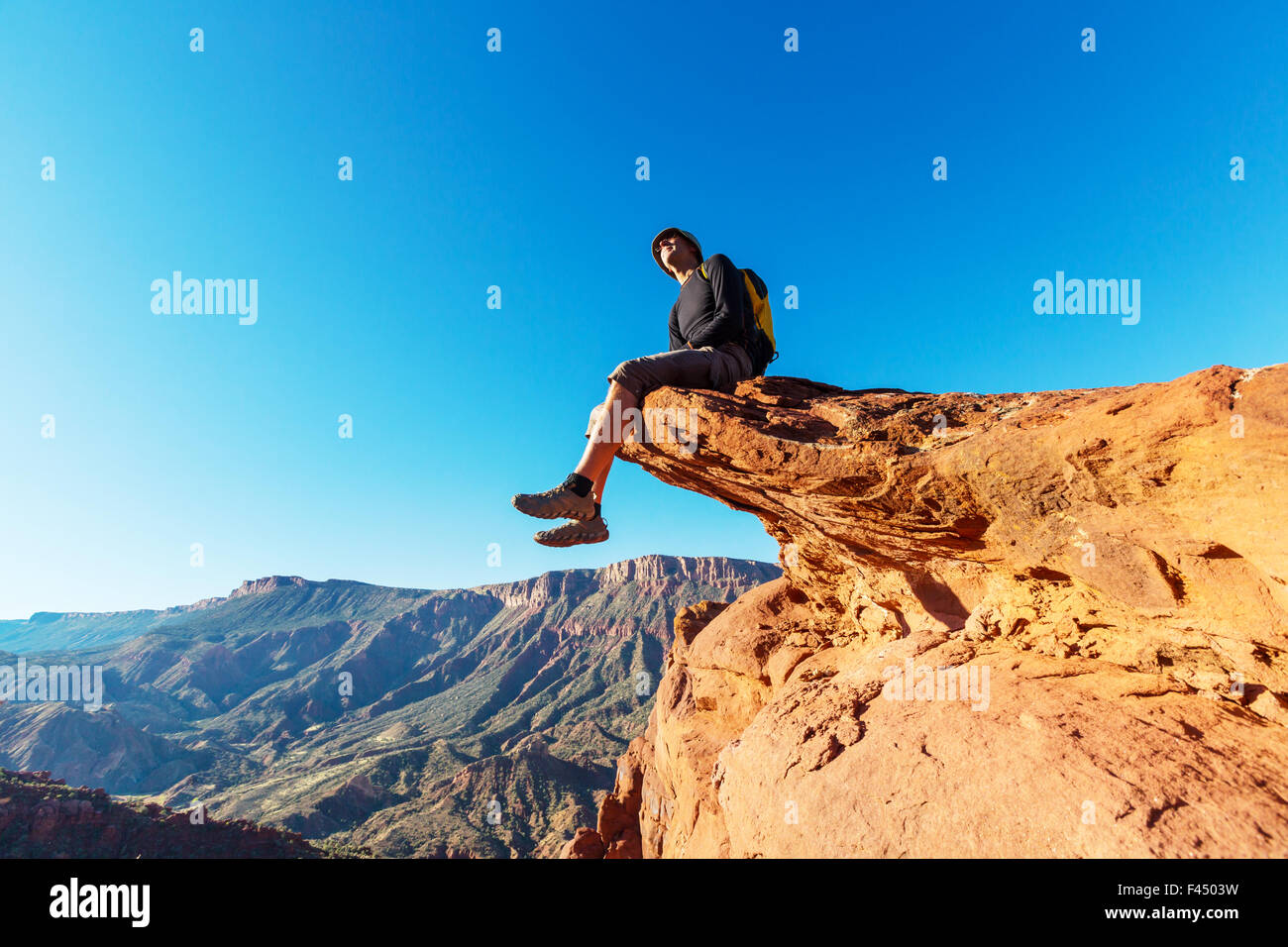 Man on the cliff Stock Photo - Alamy