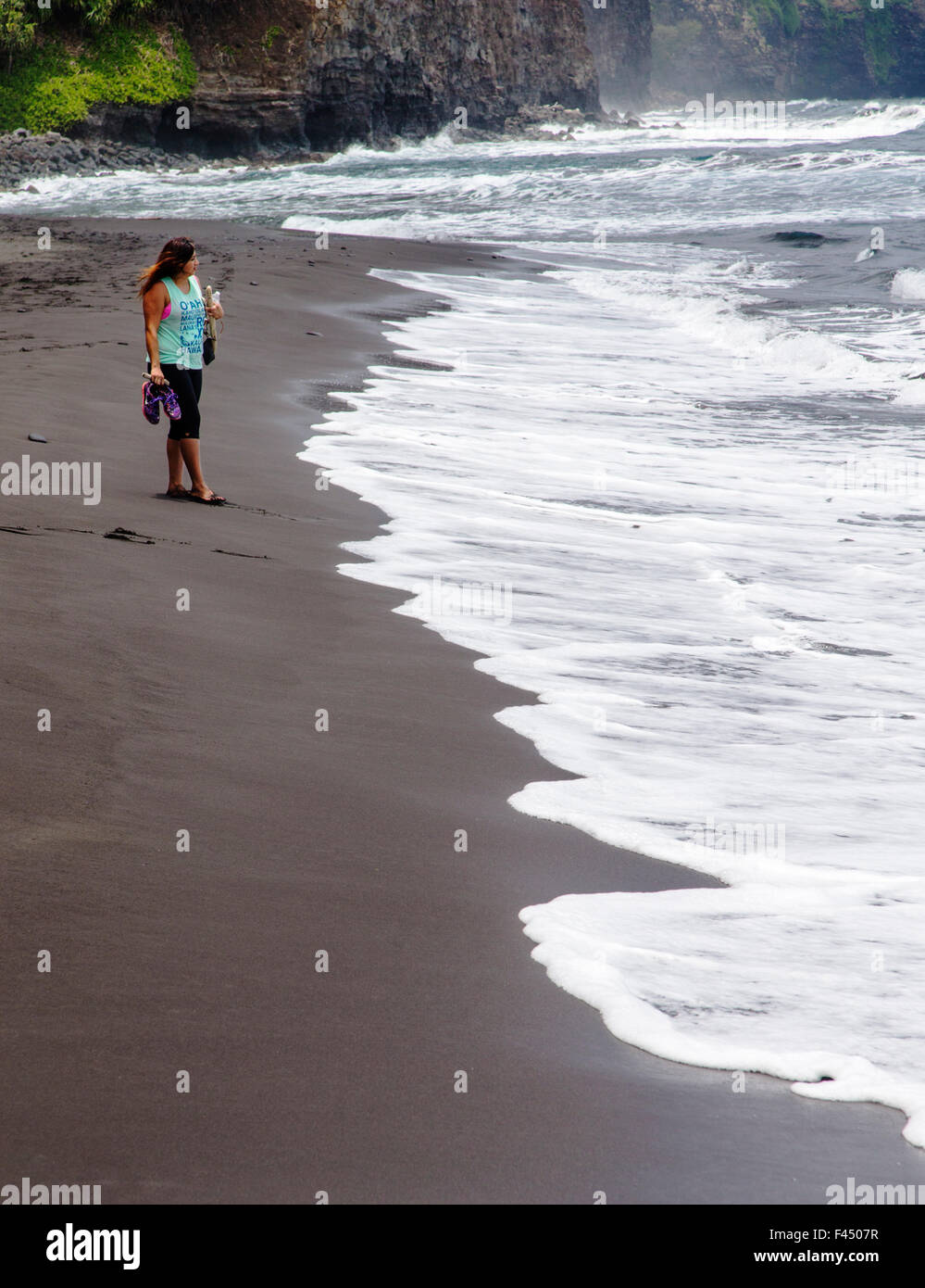 Native Hawaiian woman on beach at Akoakoa Point, Polulu Valley, Big ...