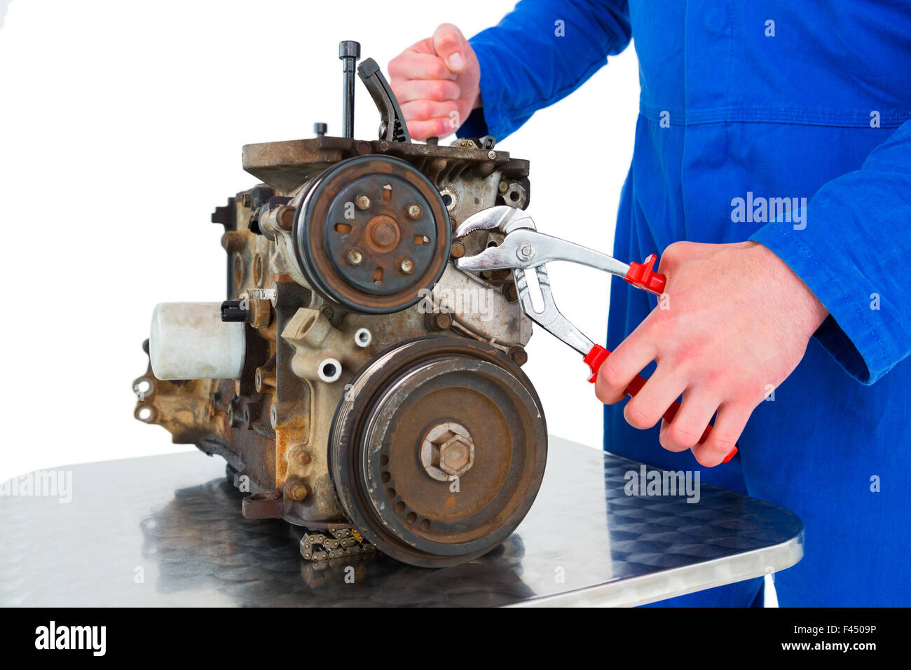 Male mechanic repairing car engine Stock Photo - Alamy