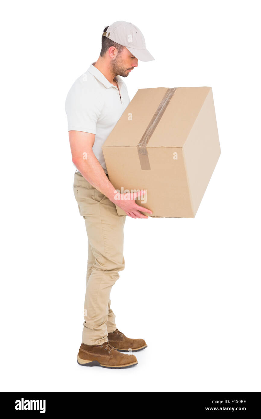 Delivery man carrying package Stock Photo - Alamy