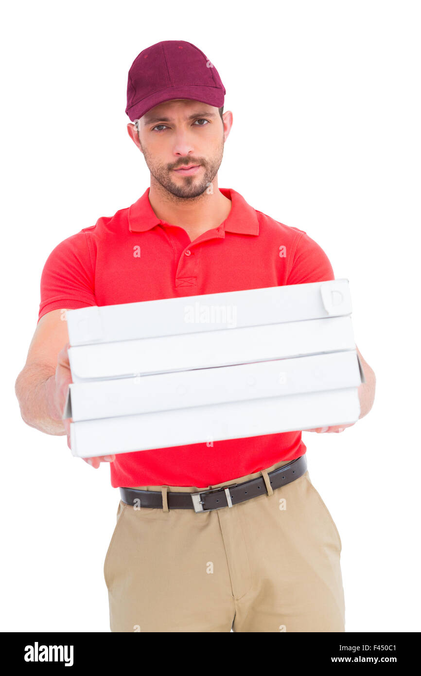 Delivery man giving pizza boxes Stock Photo - Alamy