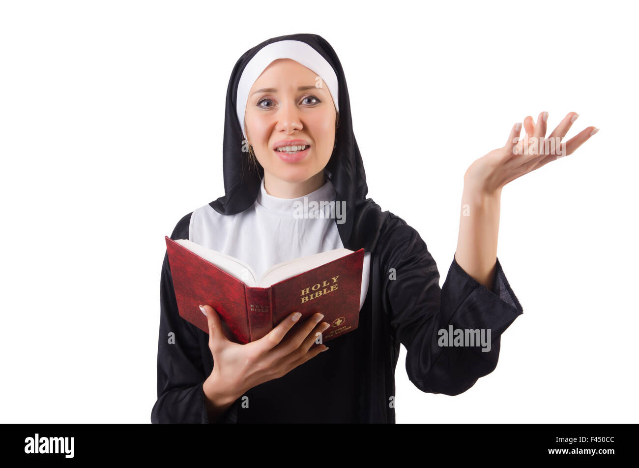 Pretty nun with Bible isolated on white Stock Photo - Alamy