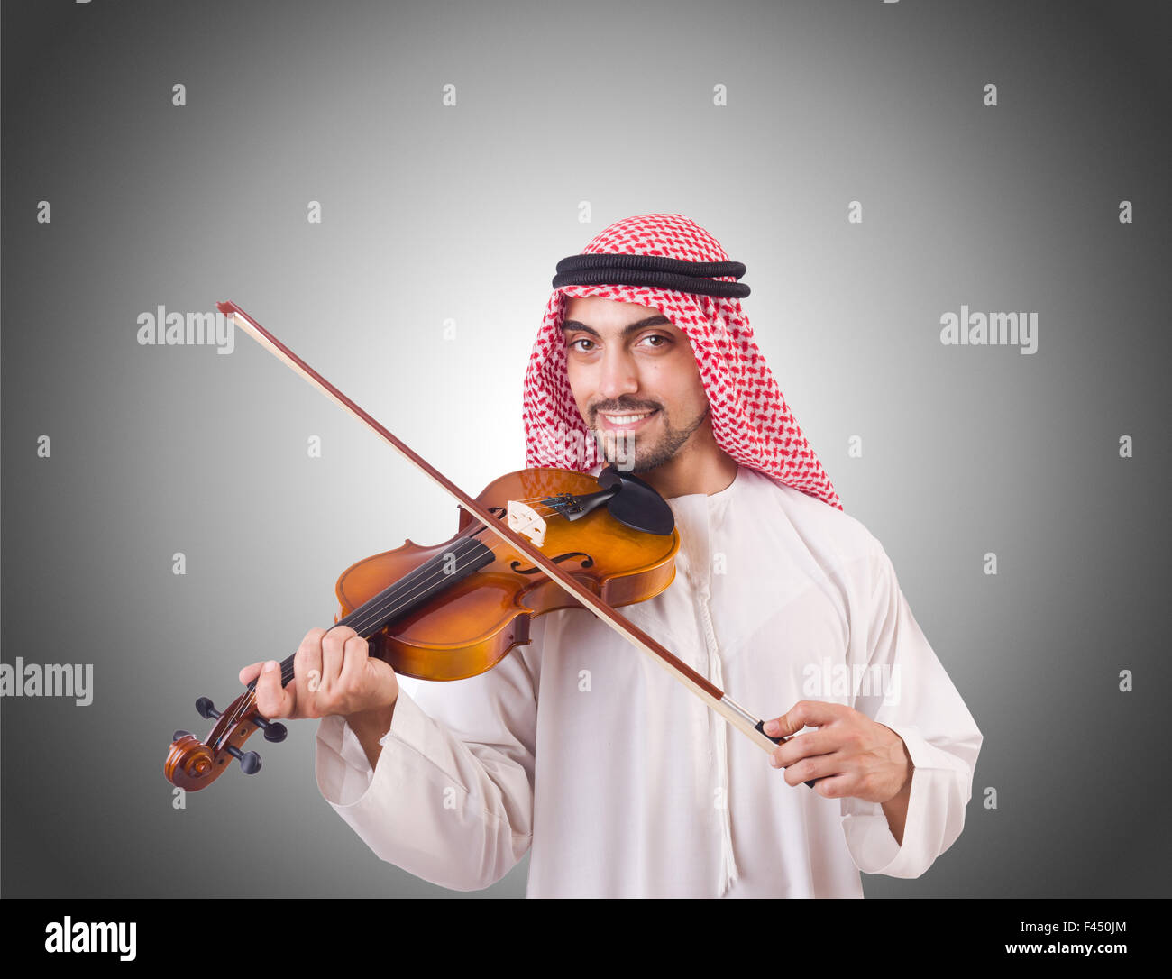 Arab man playing music on white Stock Photo - Alamy