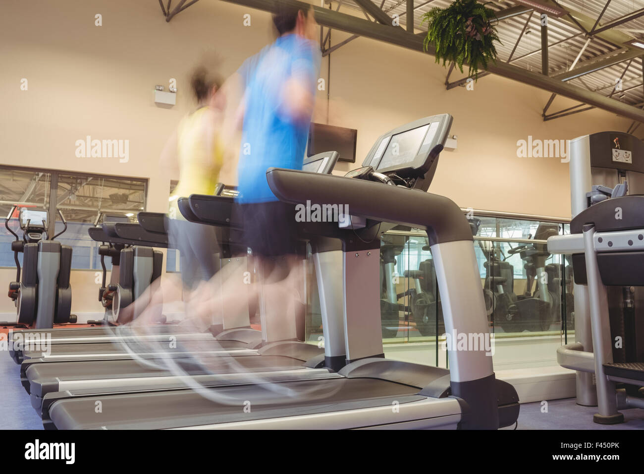 Fit people using the treadmill Stock Photo - Alamy