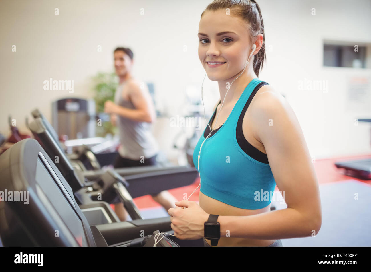 Fit woman on treadmill headphones hi-res stock photography and images ...