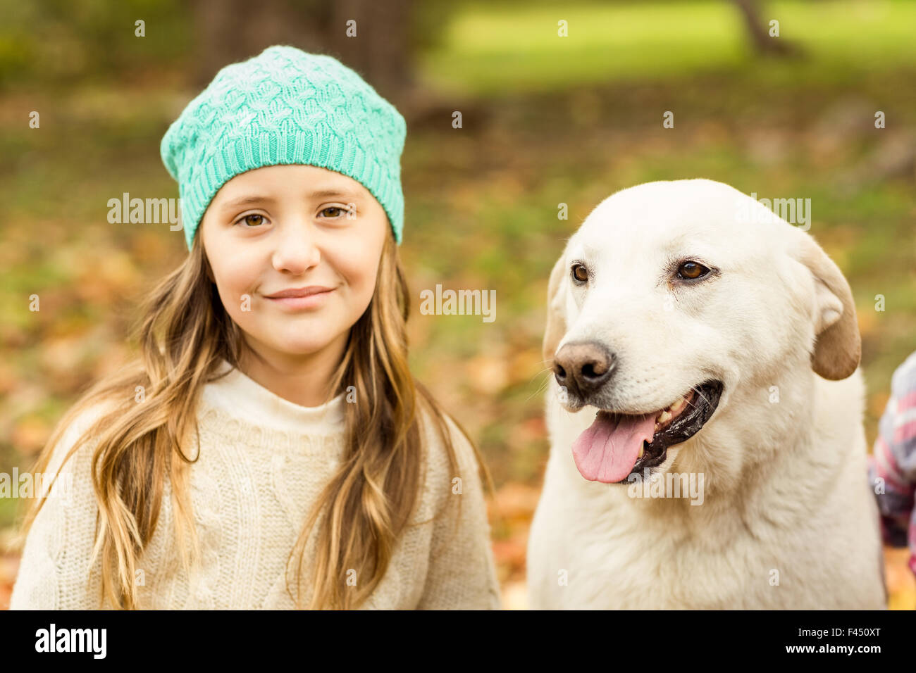 Smiling young girl with her dog Stock Photo - Alamy