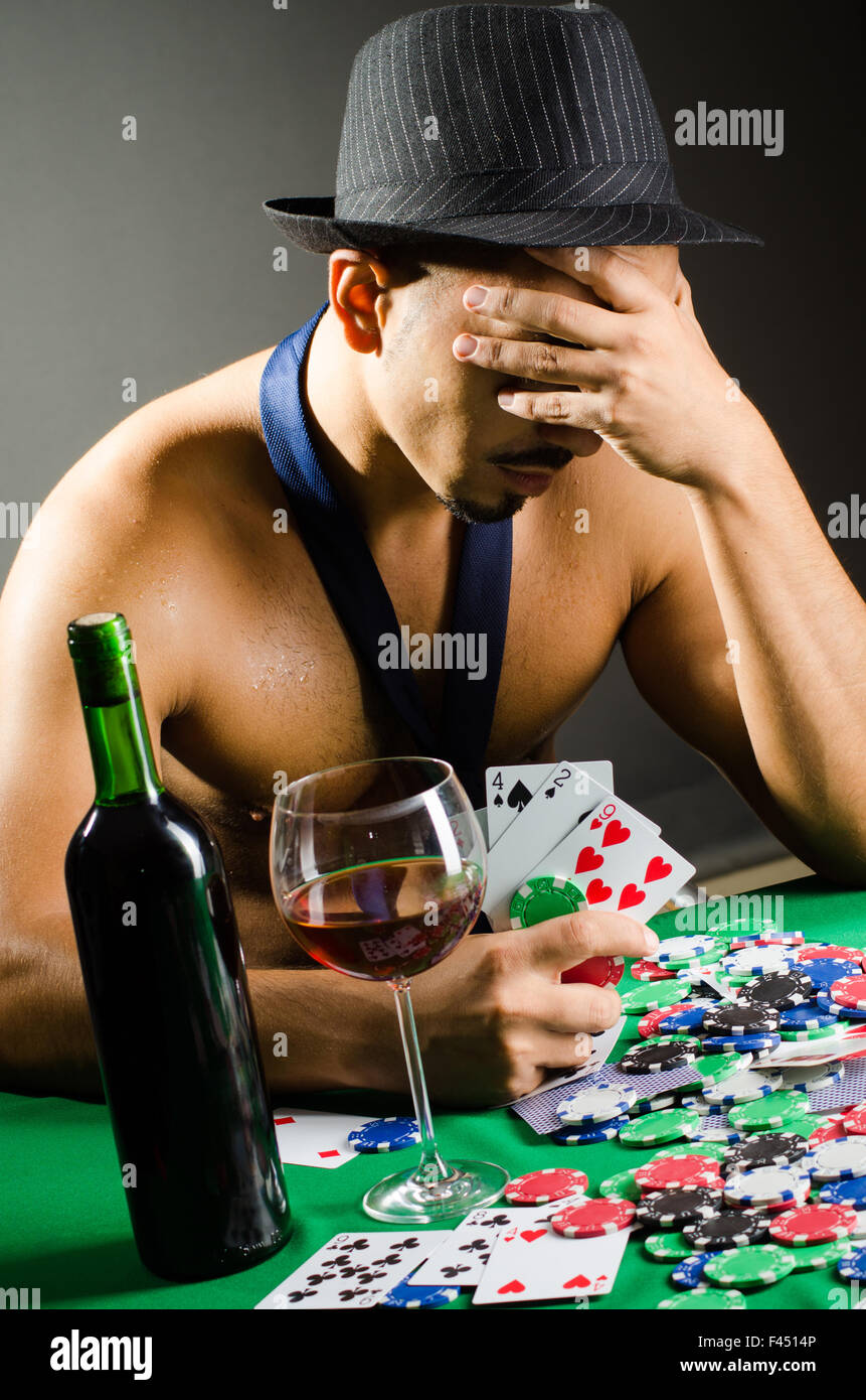 Man drinking and playing in casino Stock Photo - Alamy