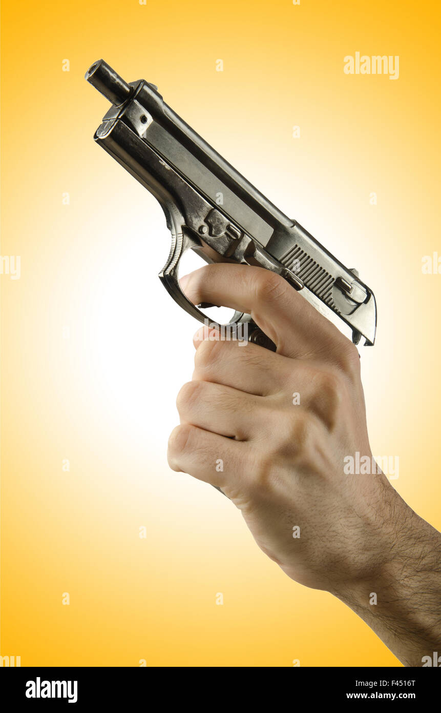 Gun in the hand on white Stock Photo - Alamy