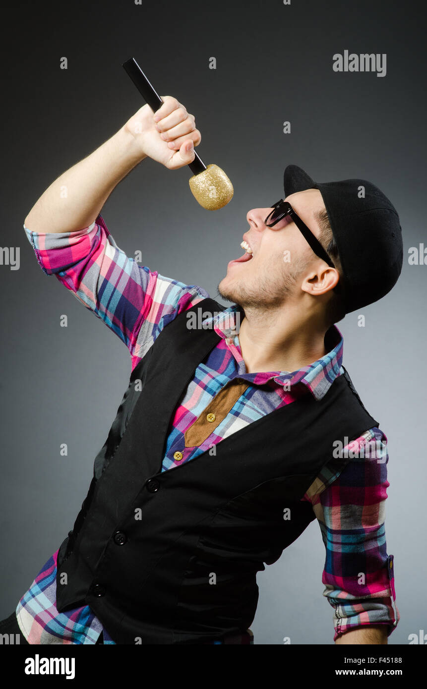 Funny man singing in karaoke Stock Photo - Alamy