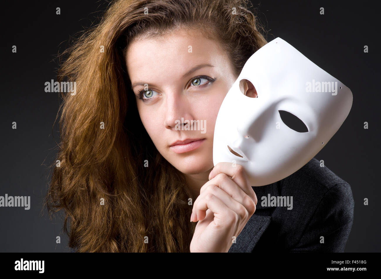 Woman with mask in hypocrisy concept Stock Photo - Alamy