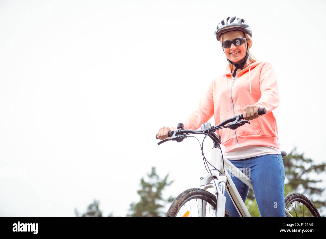 Happy woman on a bike ride Stock Photo - Alamy