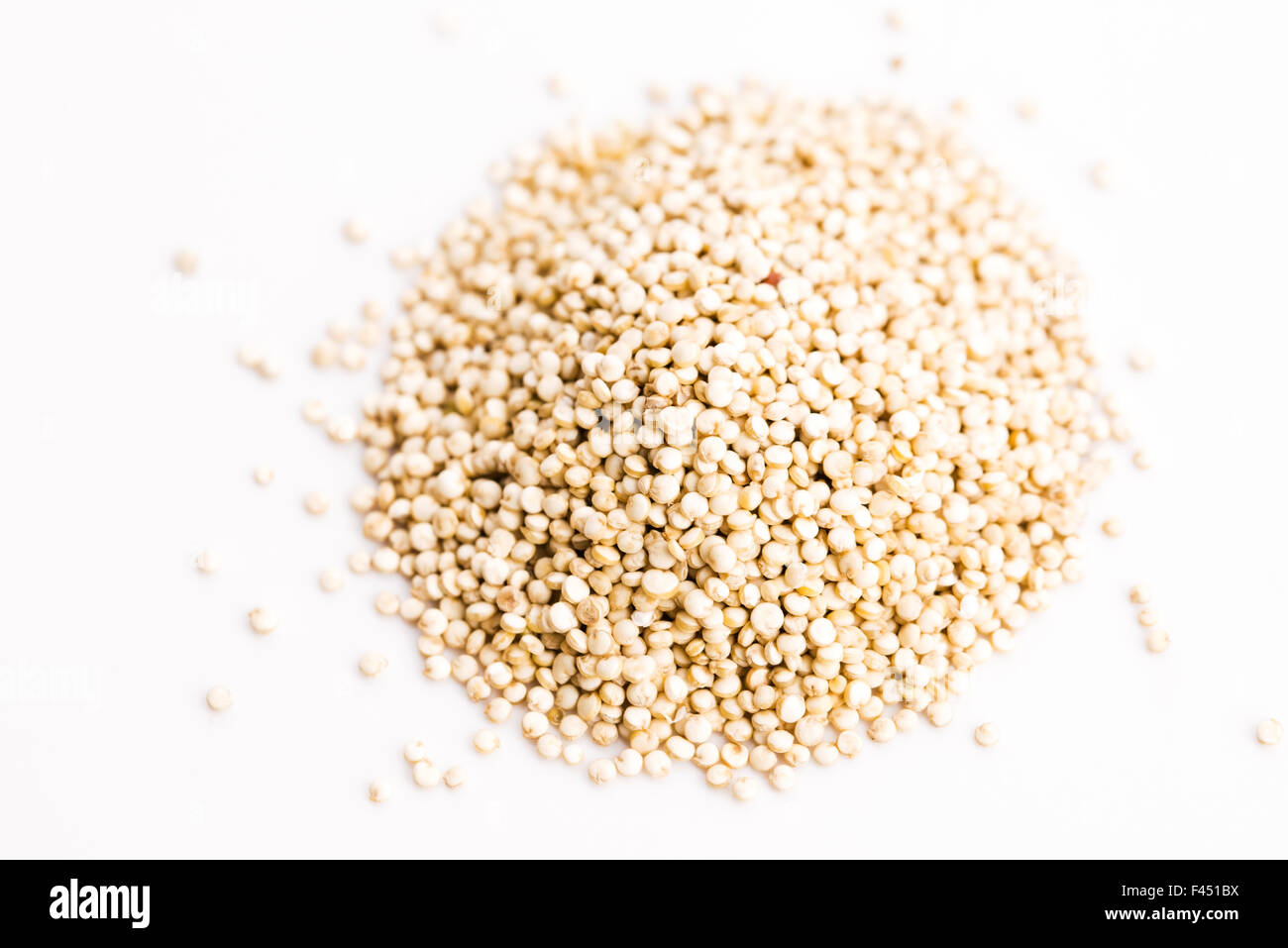 Pile of quinoa grain on a white background Stock Photo - Alamy