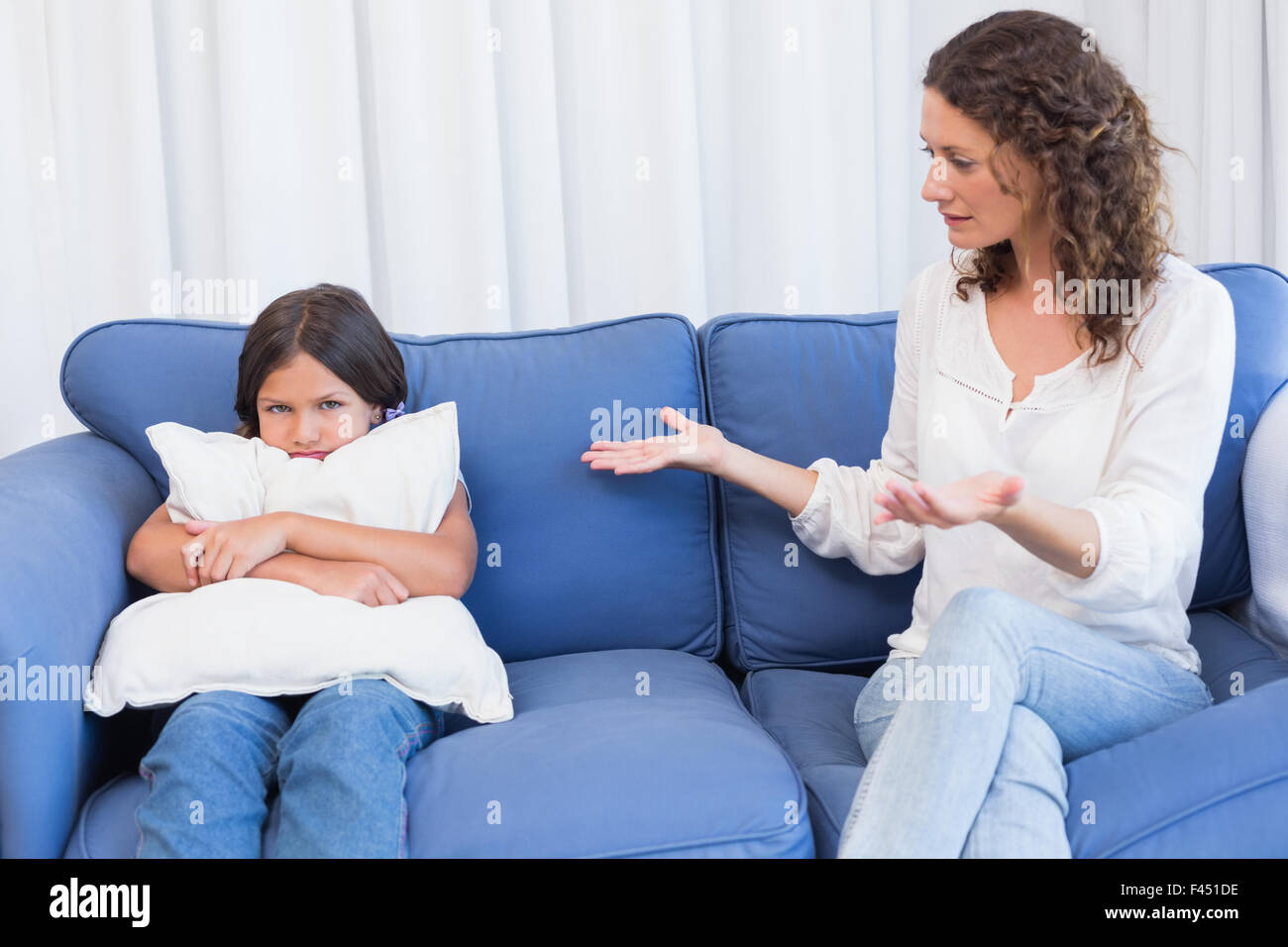 Upset mother looking at her daughter Stock Photo - Alamy