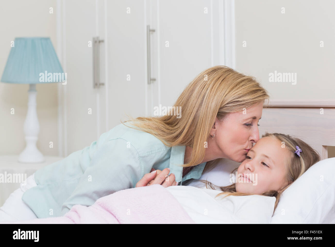 Mother kissing her daughter Stock Photo - Alamy Mother kissing her daughter Stock Photo - Alamy