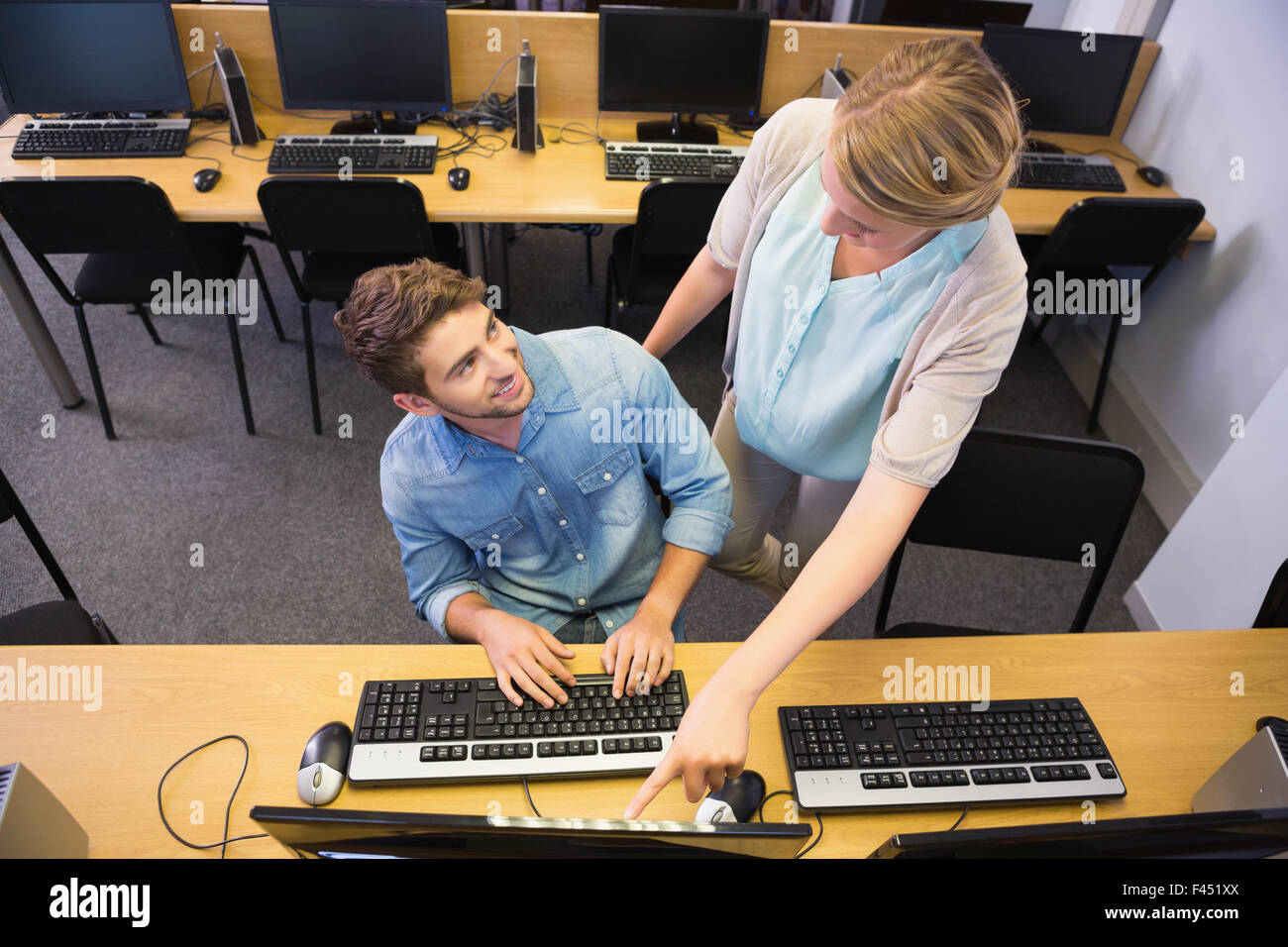 Students working on computer together Stock Photo - Alamy