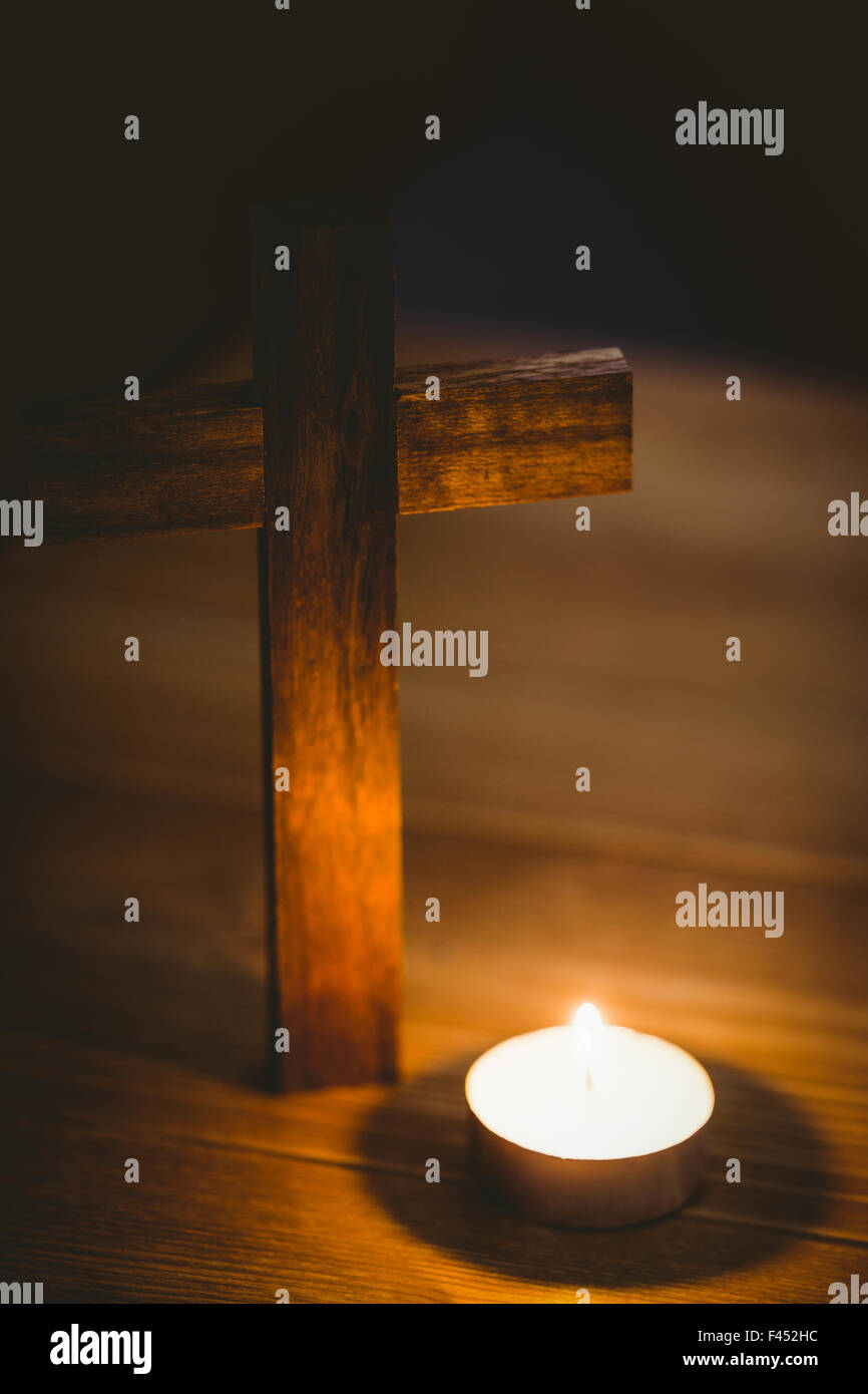 Candle and wooden cross Stock Photo - Alamy