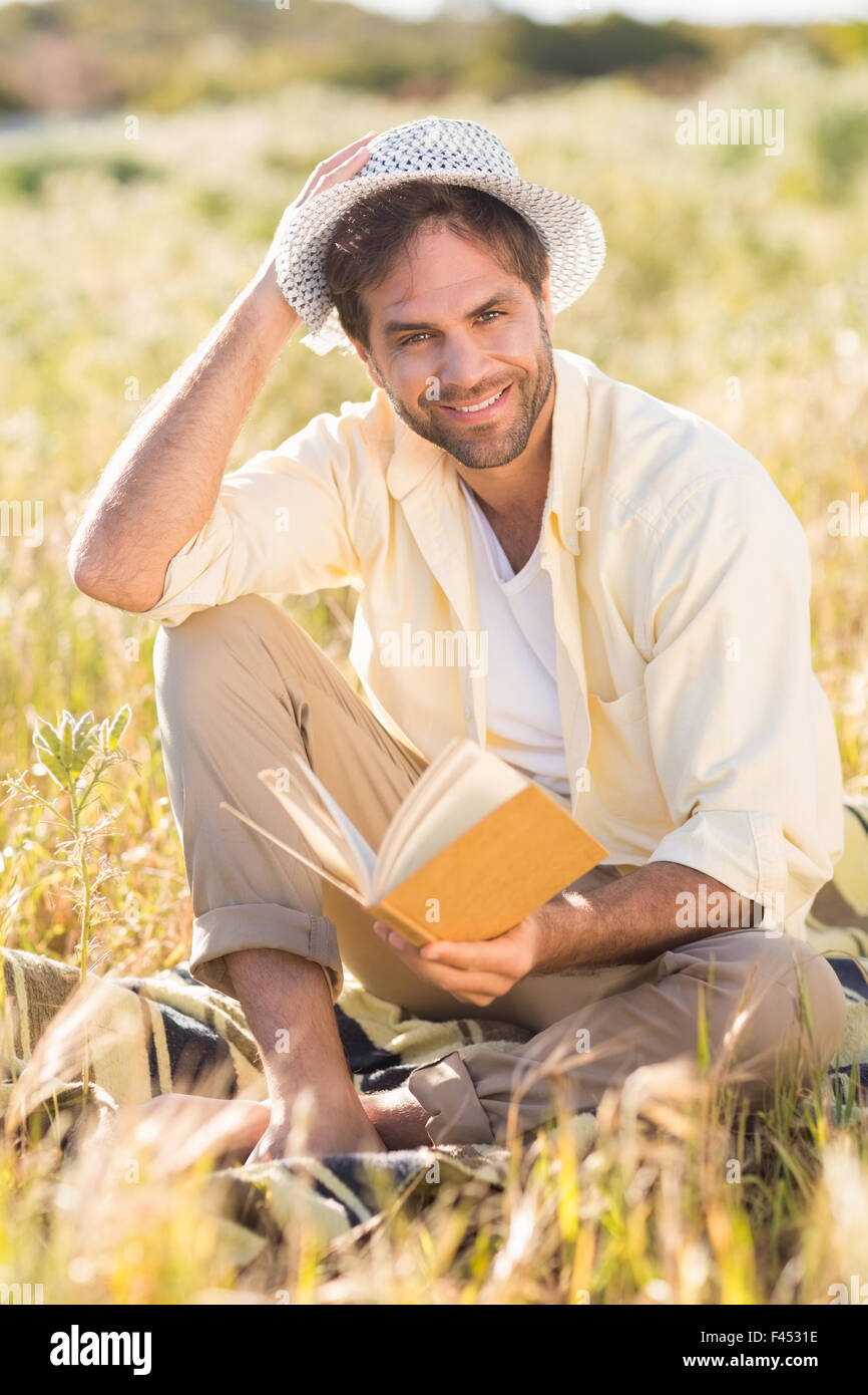 Happy man reading a book Stock Photo - Alamy