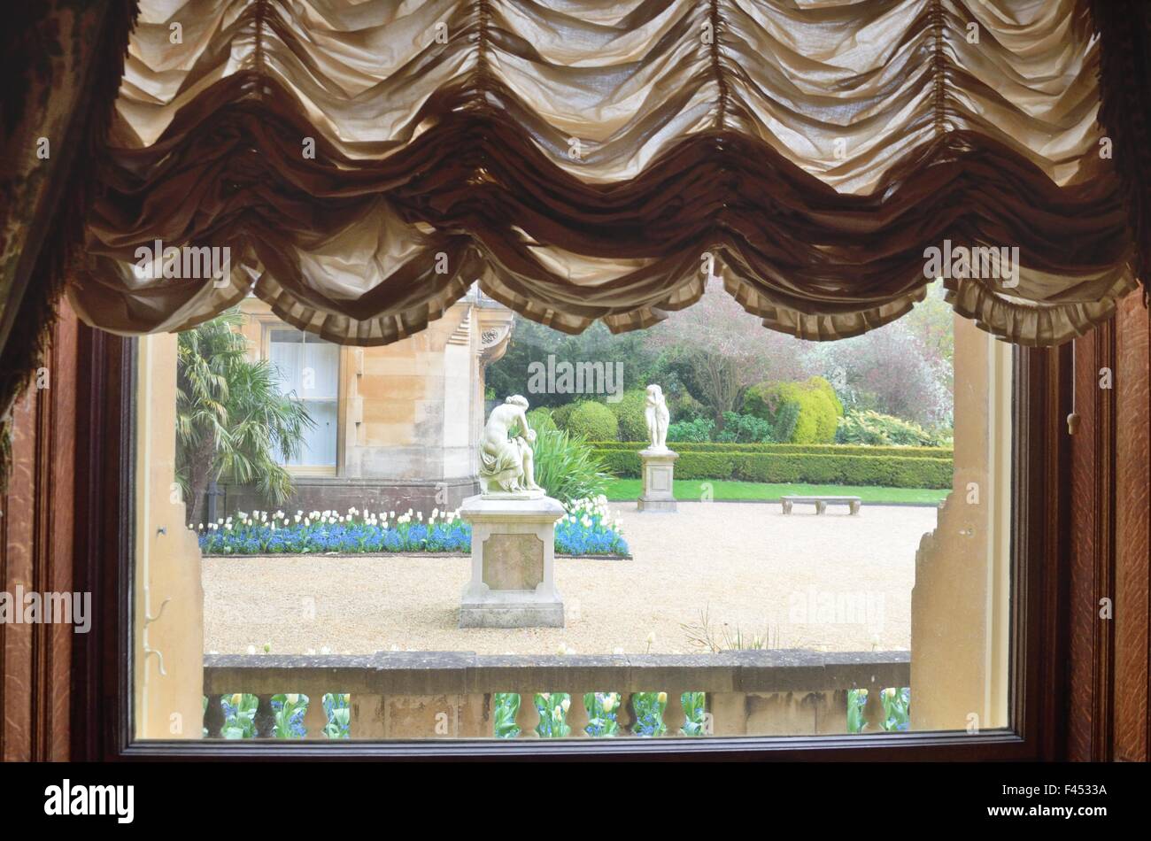 Classical Garden through window Stock Photo - Alamy