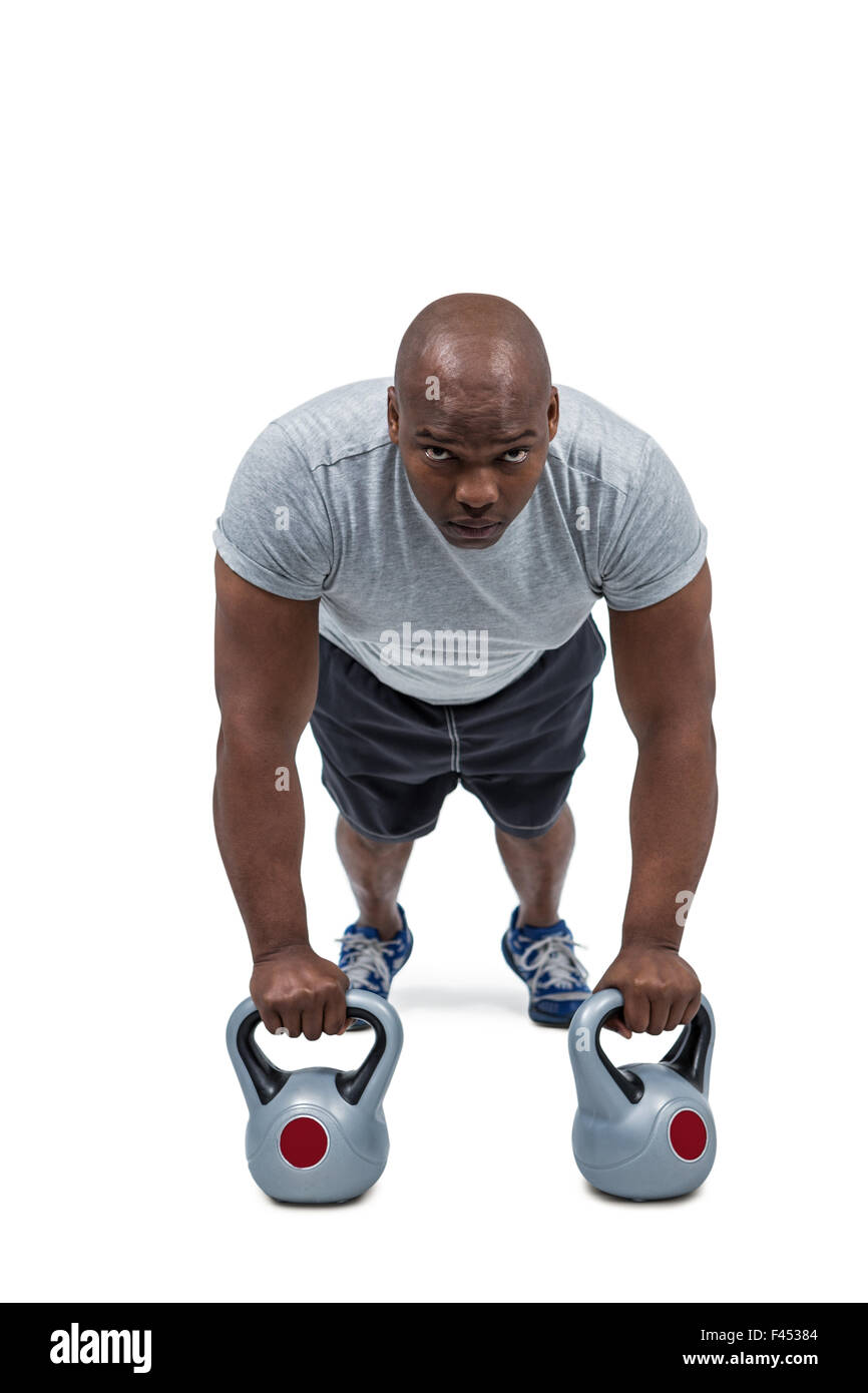 Fit man exercising with kettlebell Stock Photo - Alamy