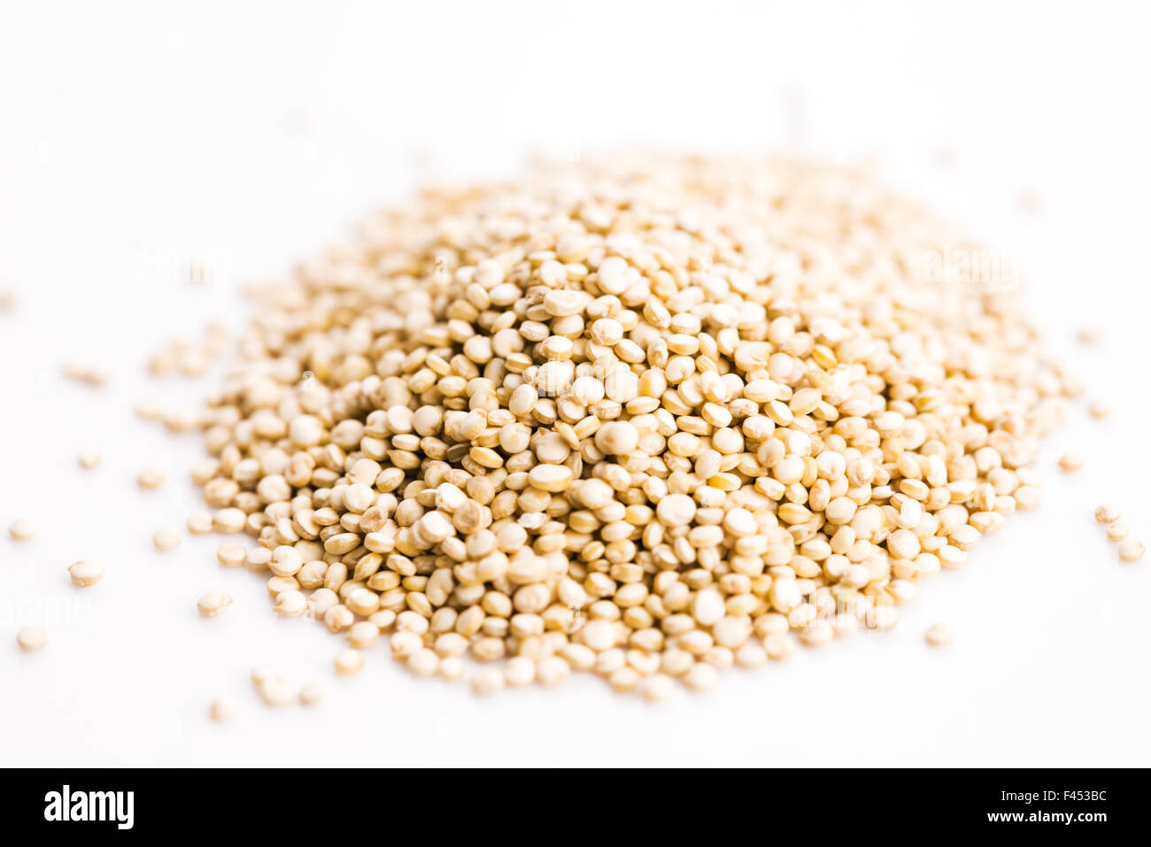 Pile of quinoa grain on a white background Stock Photo - Alamy