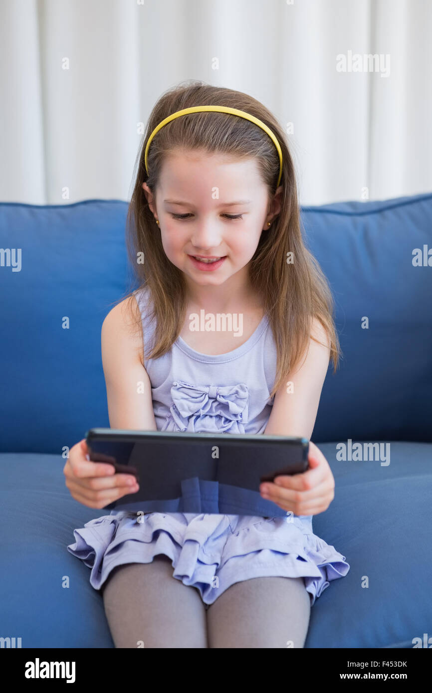 Little girl using tablet pc Stock Photo - Alamy