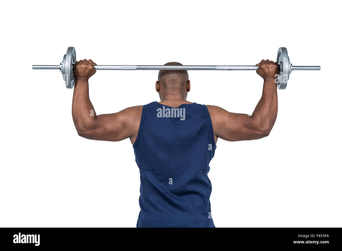 Fit man lifting heavy barbell Stock Photo - Alamy