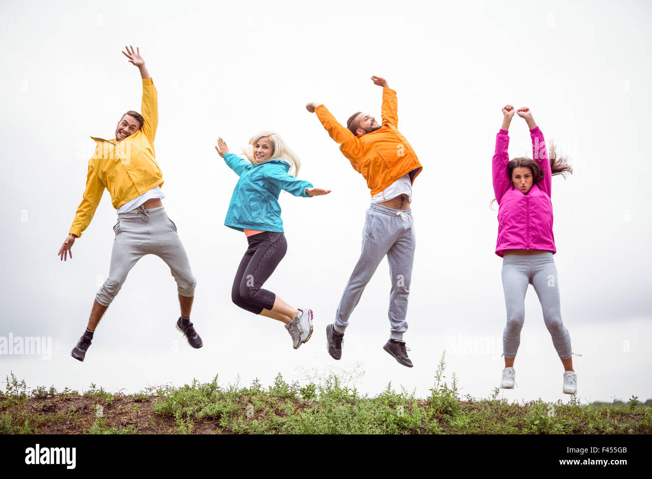 Friends jumping before a hike Stock Photo - Alamy