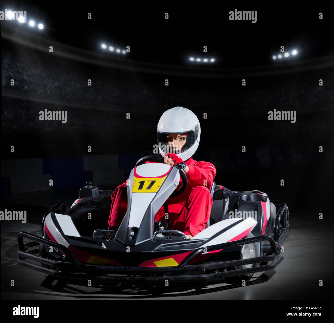Young girl karting driver at sports hall Stock Photo - Alamy